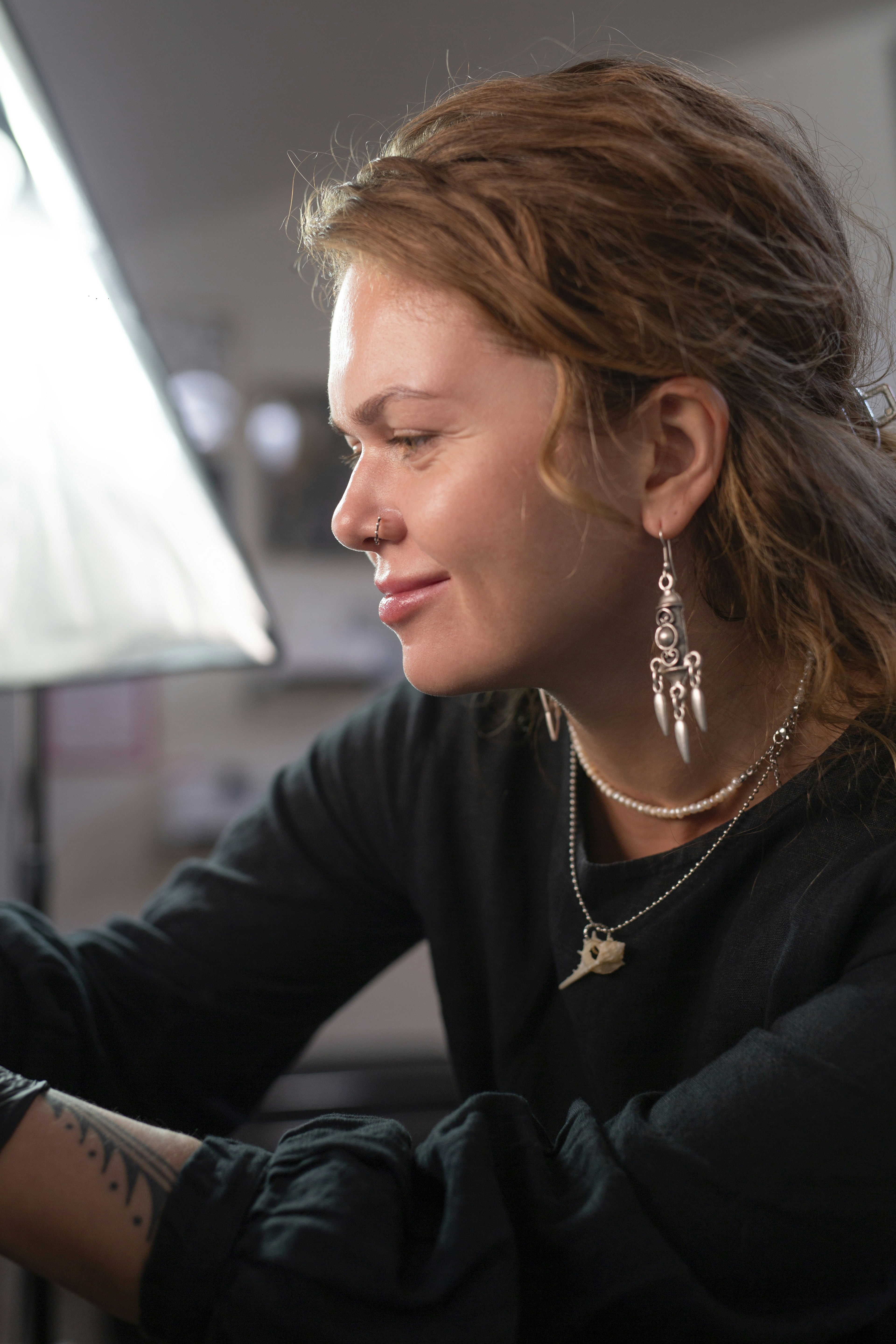 Soft Studio Portrait of a Woman in Profile with Jewelry