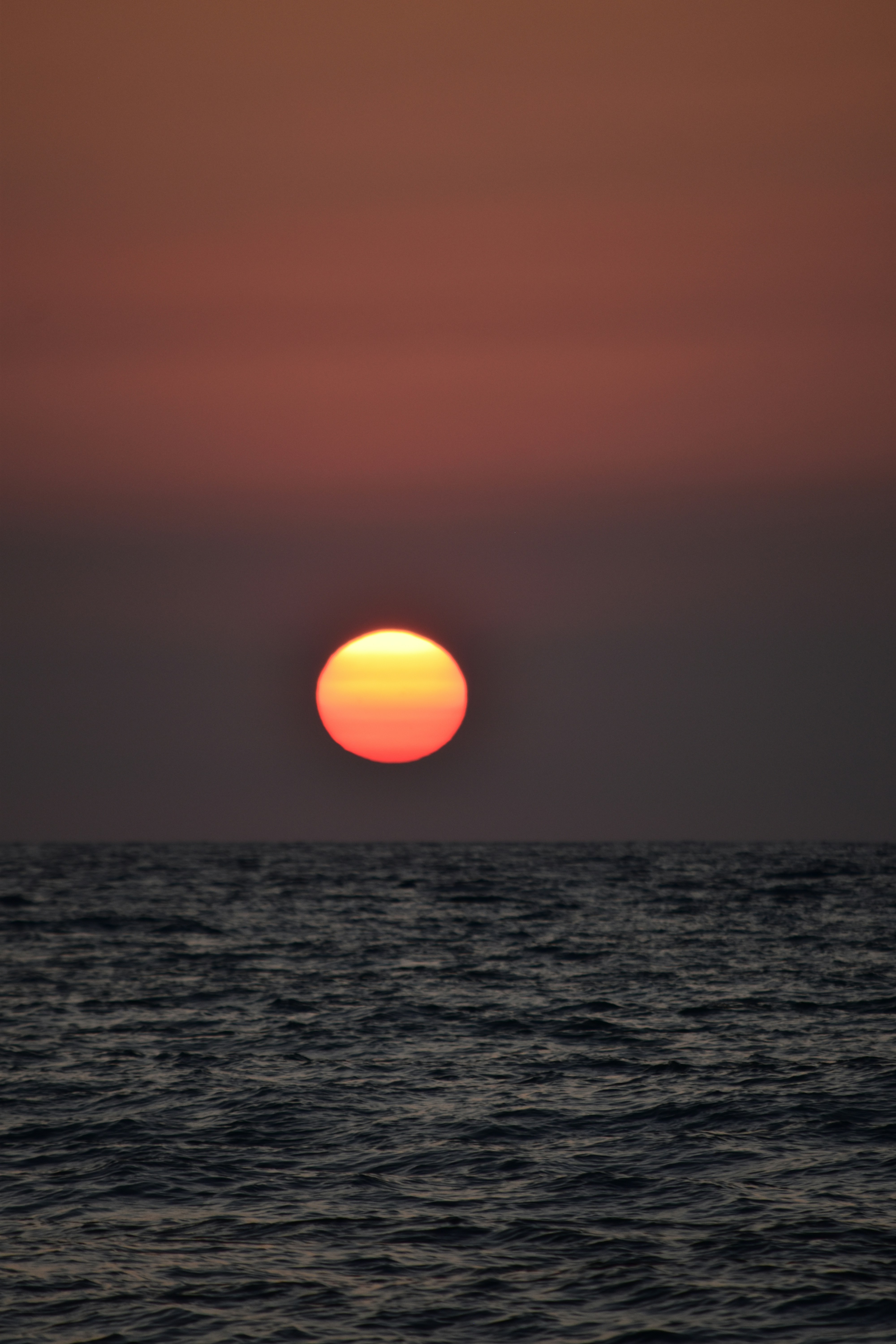 Sun on the Horizon: A Quiet Dusk Over the Ocean