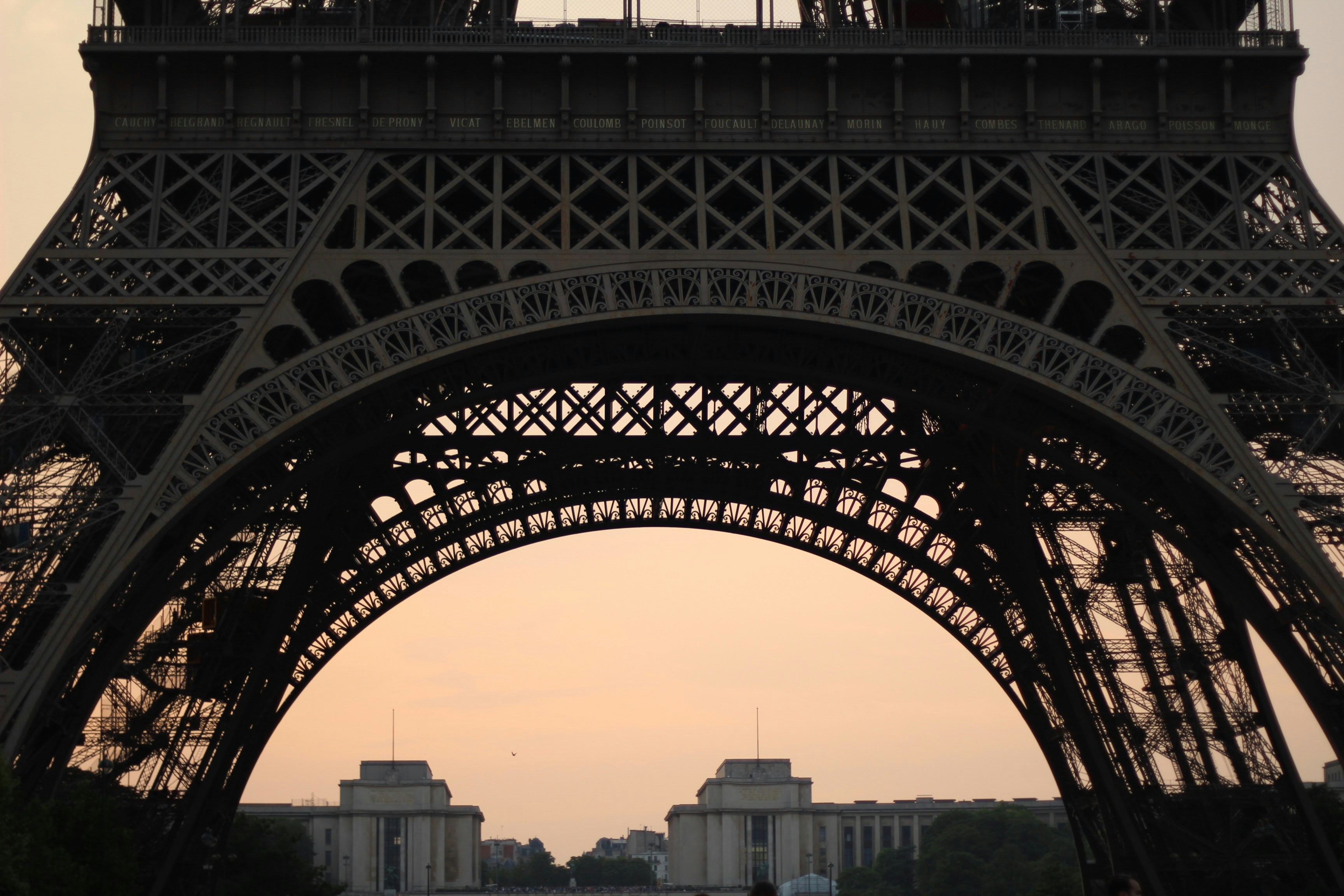 Sunset Silhouette Under the Eiffel Arc