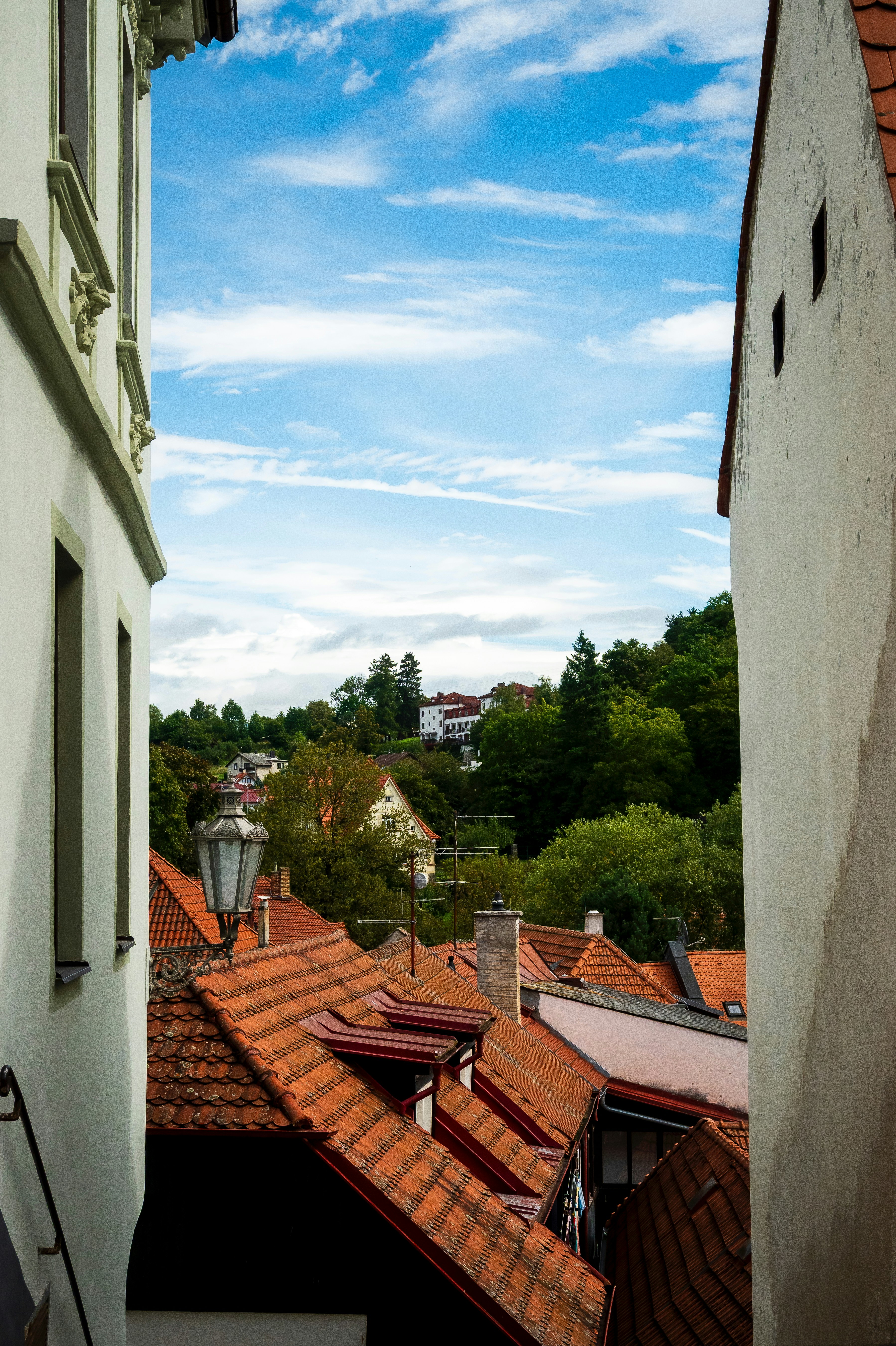 Between Two Roofs: A Quiet Corridor to the Crest of a Village