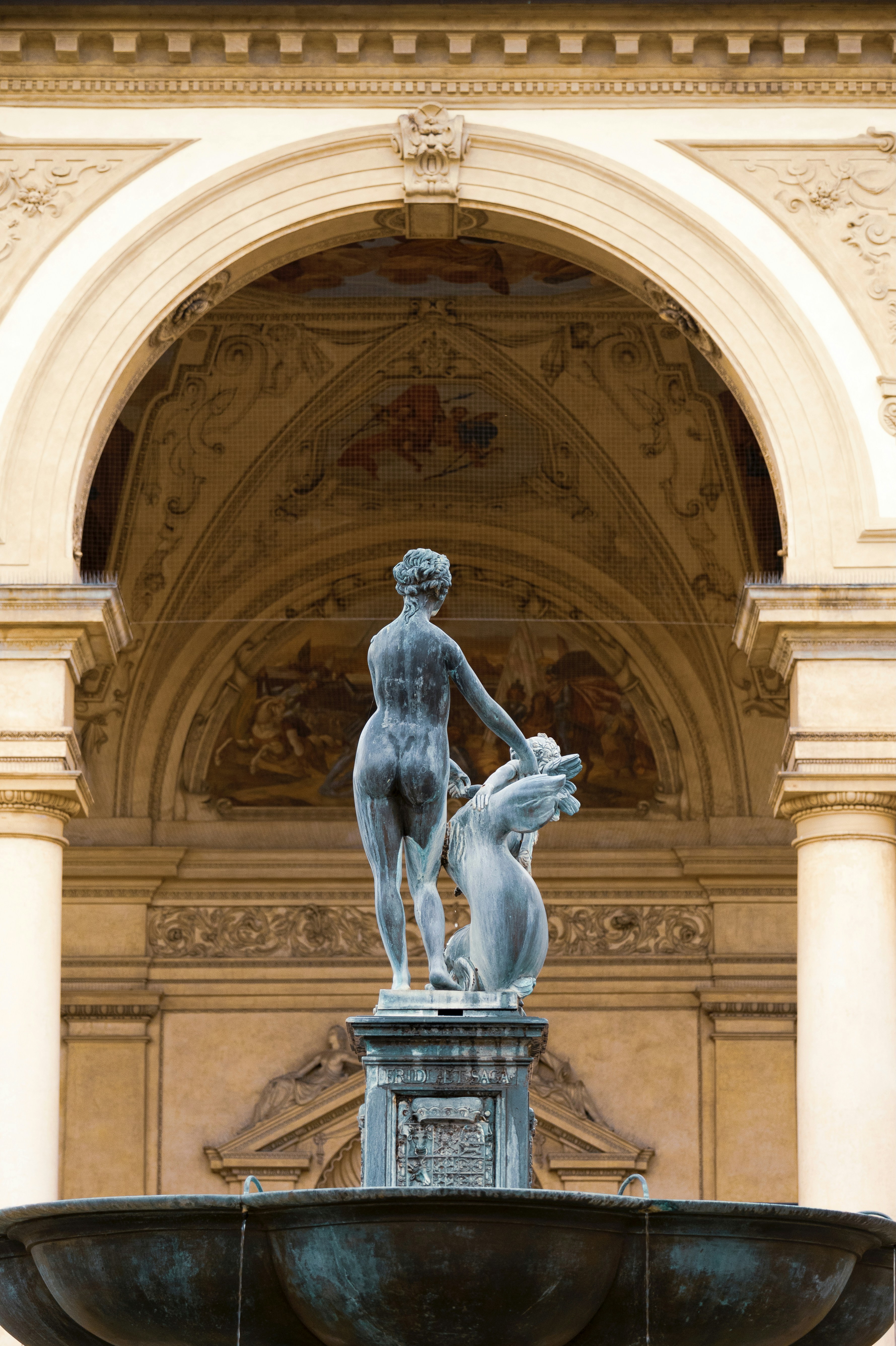 Statue of a Youth with Seabird by a Classical Arch