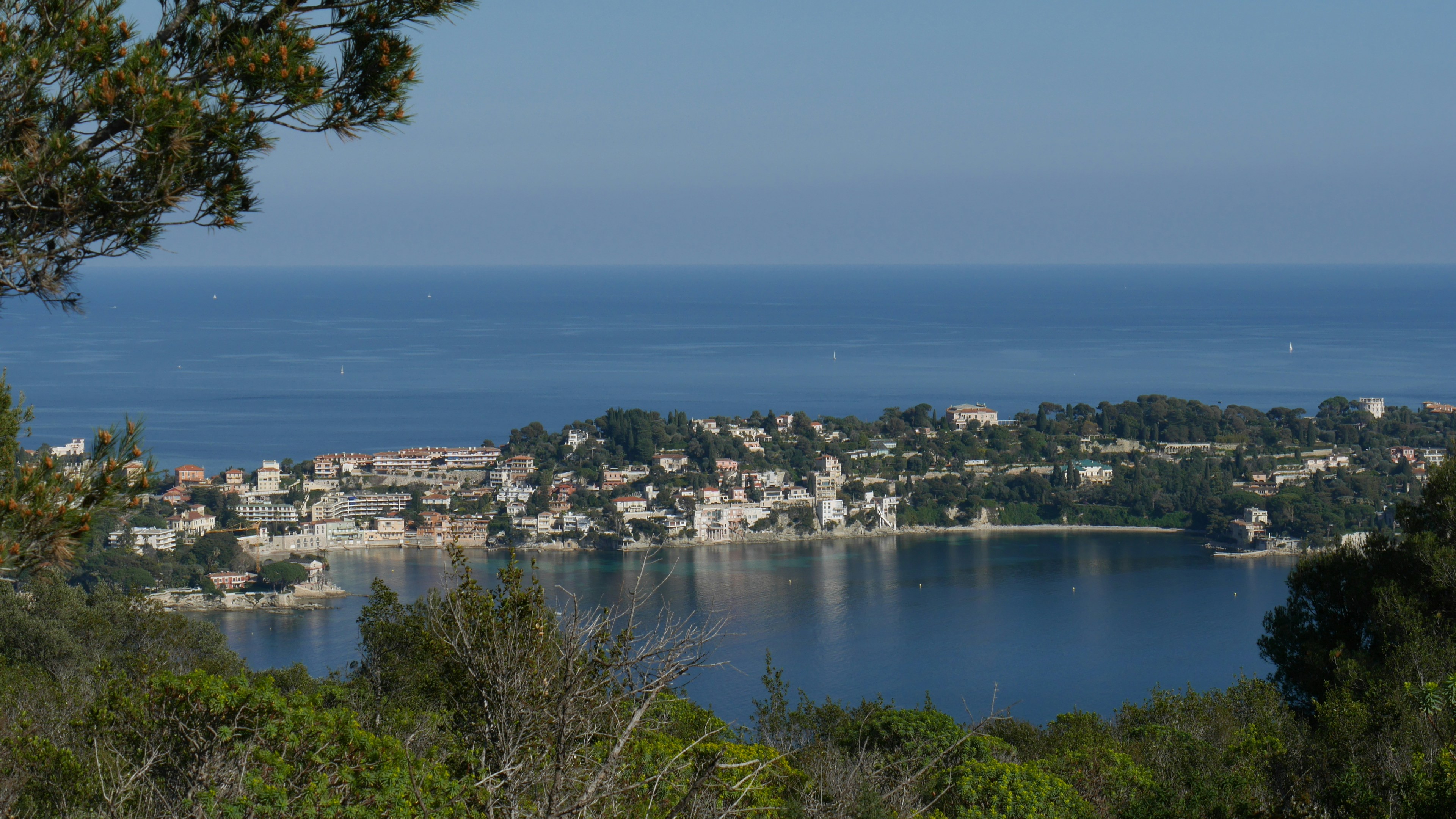 Seaside Terrace: A Quiet Coastal Town Framed by Hills