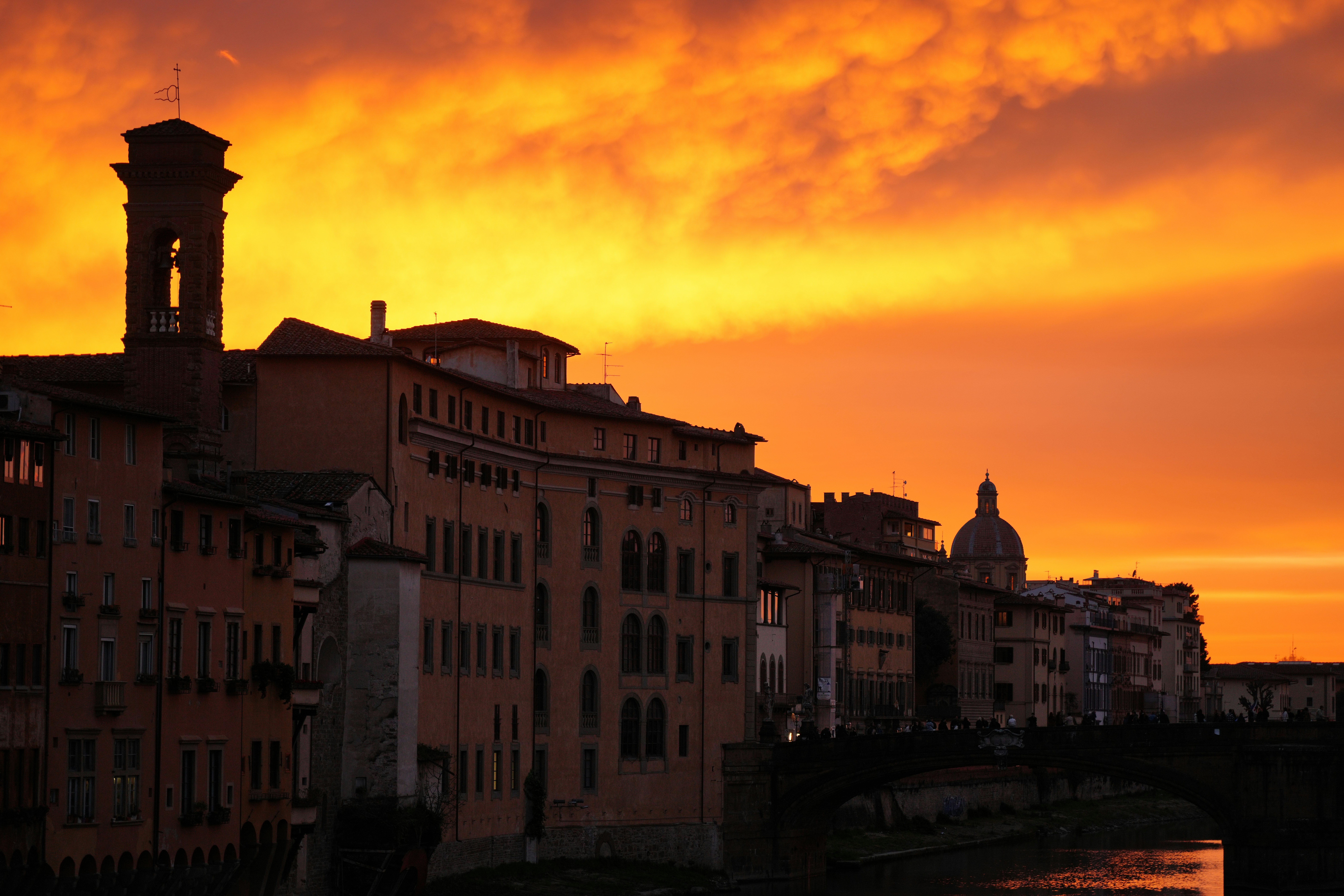 Sunset Silhouette Over the Arno: A Venetian Panorama