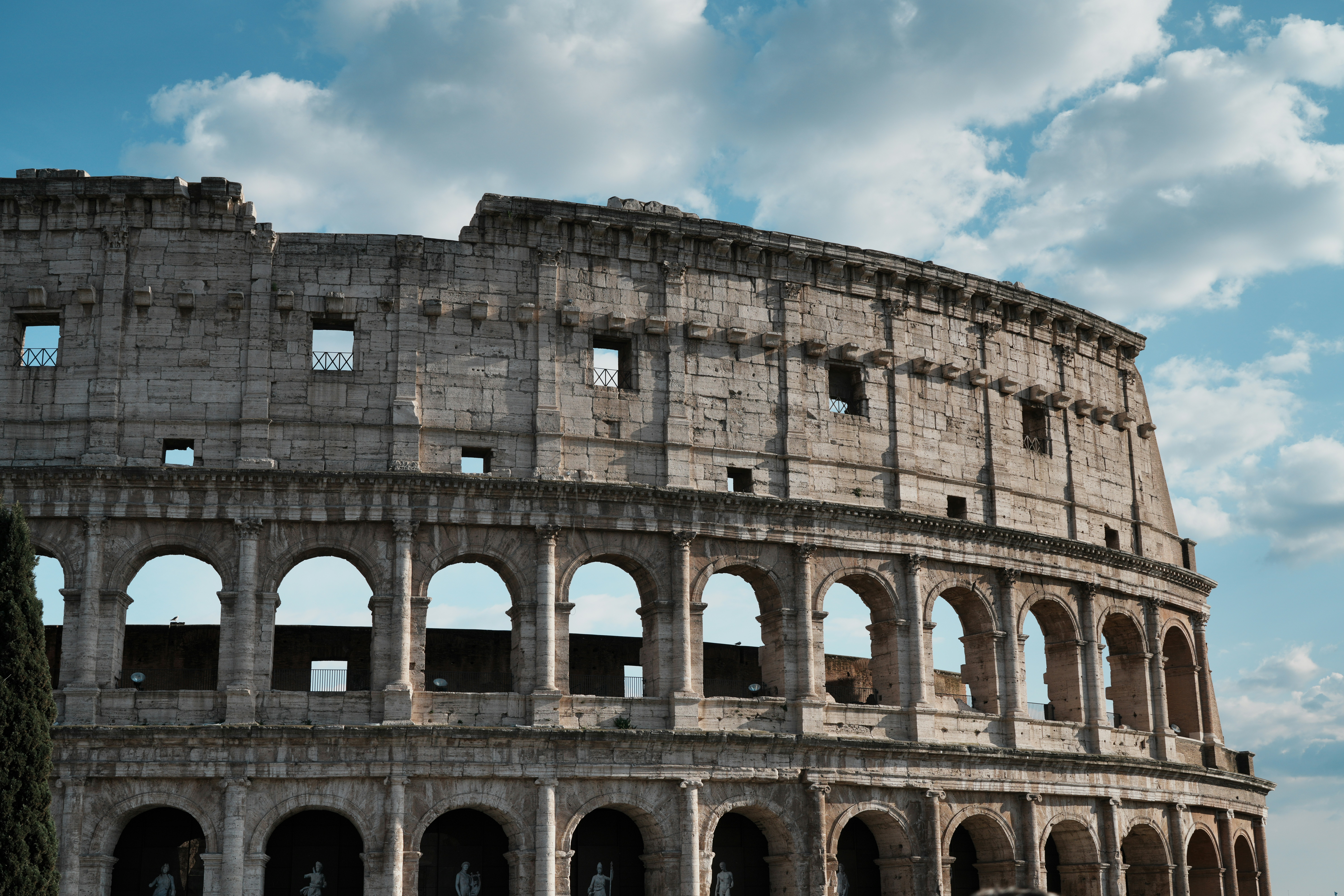 Stone Arches Under a Bright Sky: The Colosseum in Focus