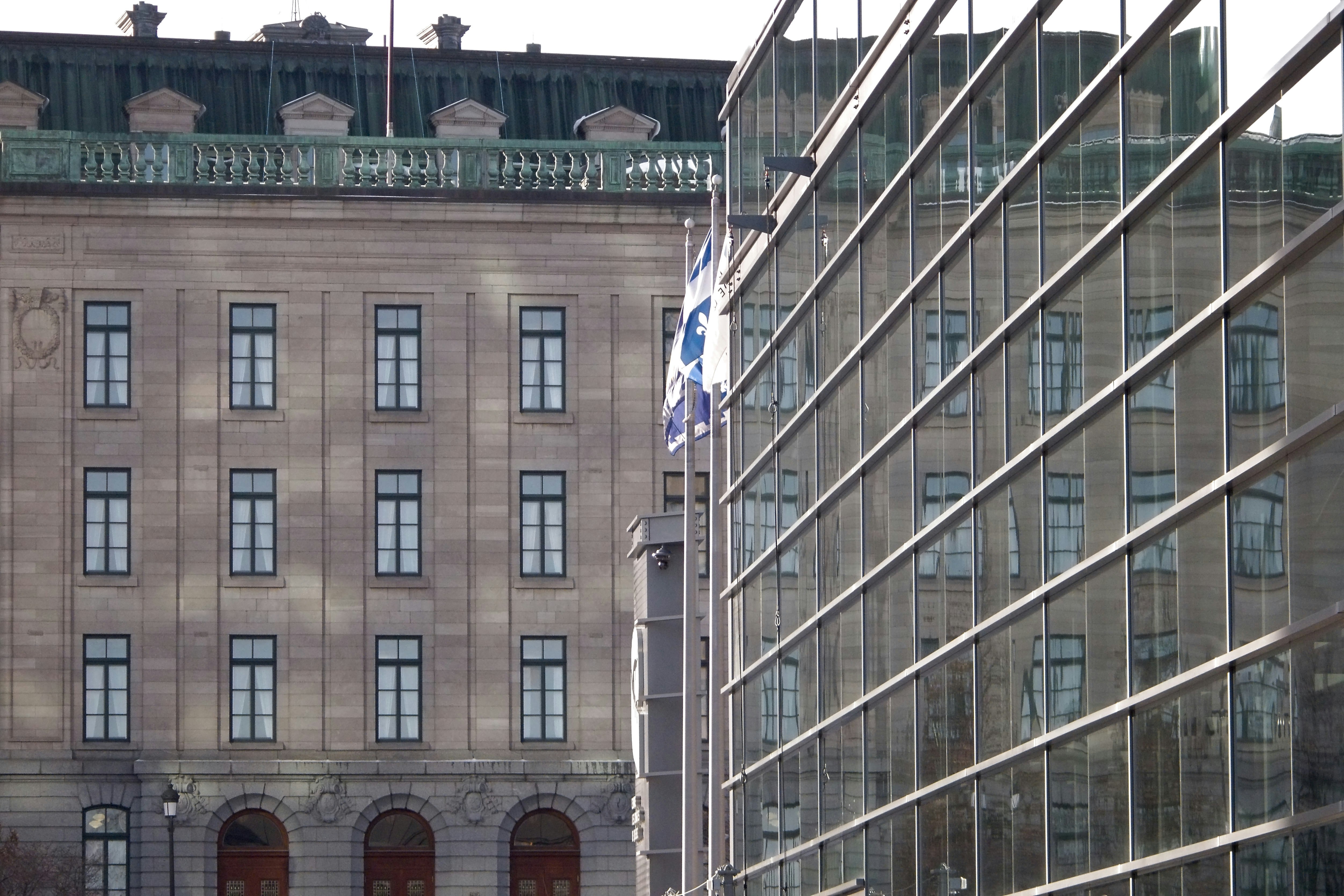 Glass Facade Mirrors the Historic Stone Facade