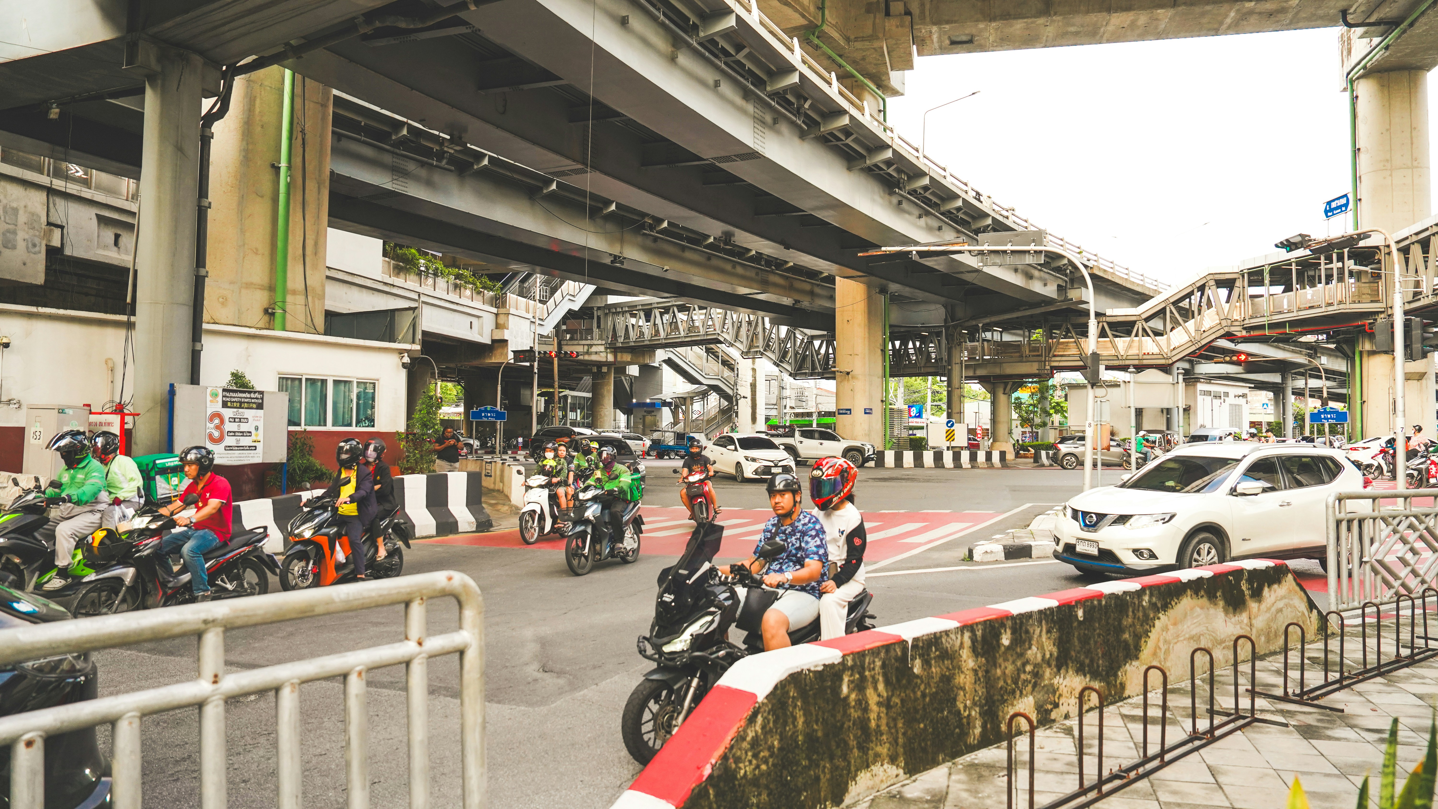 Rush Hour at the Urban Overpass: Motorbikes Weaving Through Concrete Corridors