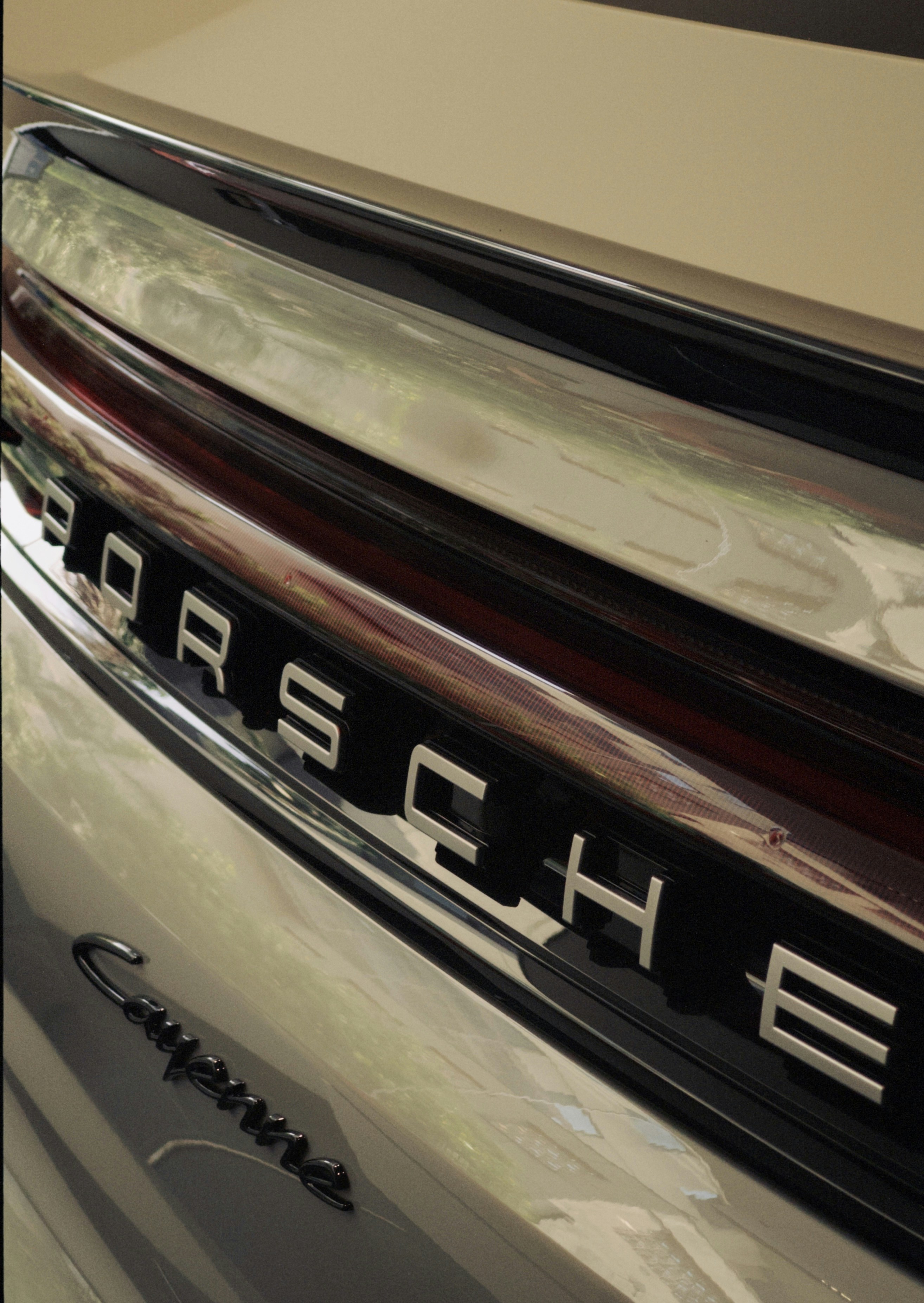 Chrome Script: The Porsche Crest in Quiet Dawn