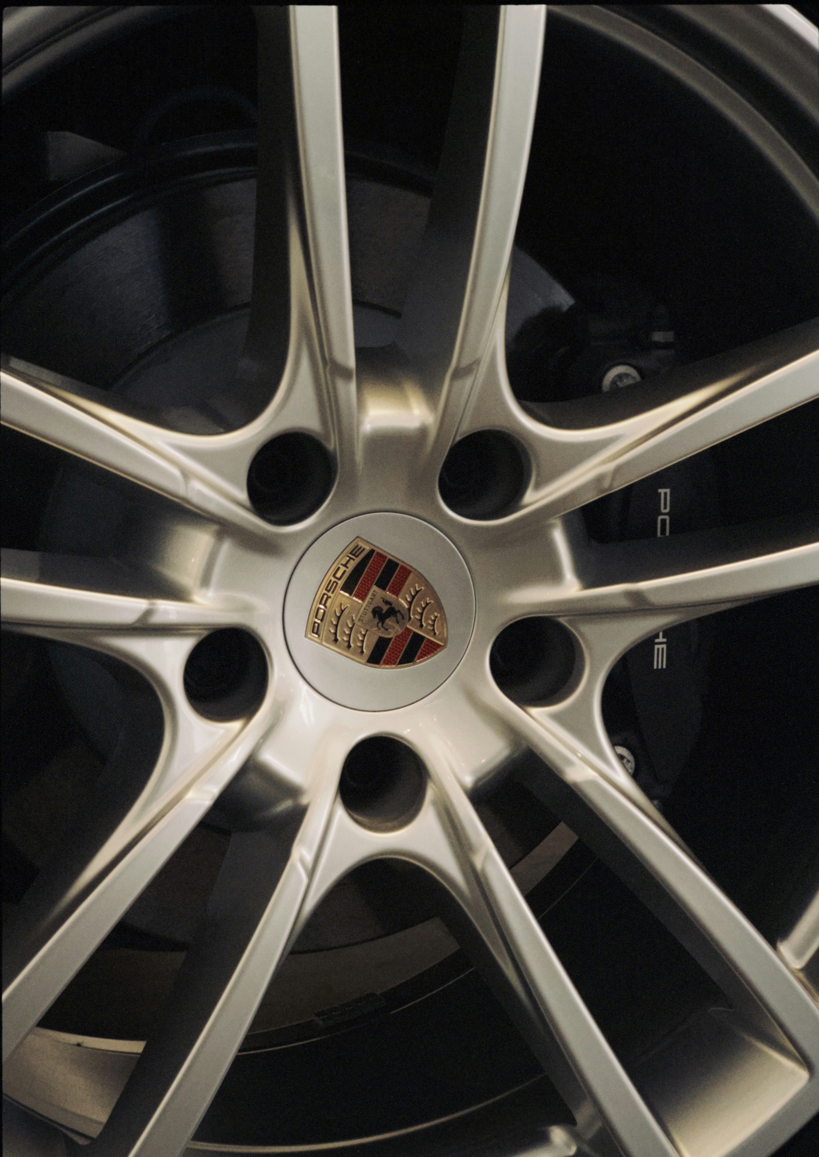 Porsche Crest Centerstage on Gleaming Alloy