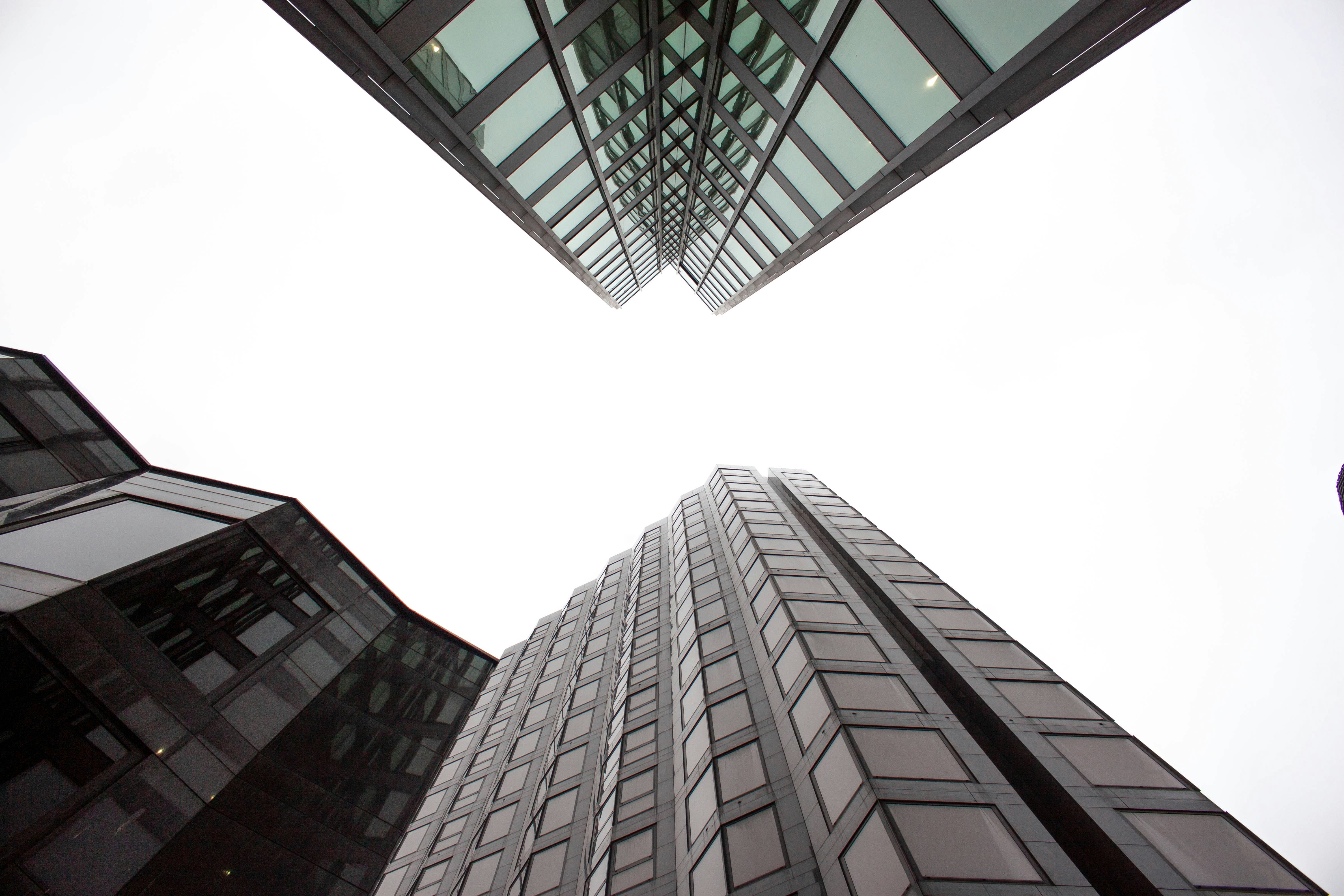 Architectural Convergence: A Looming Canyon of Glass