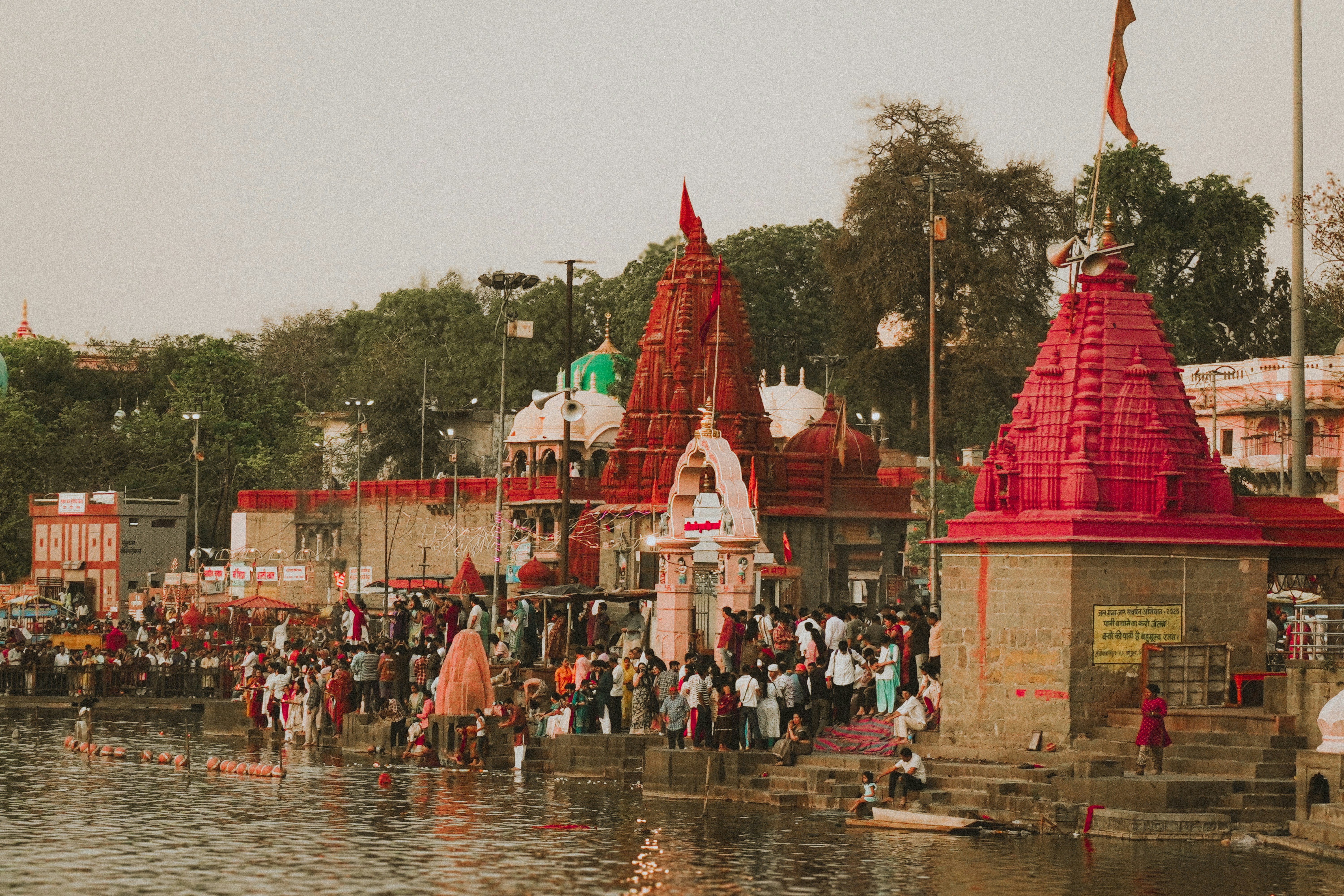Temple Complex by the Water: A Riverside Festival Crowd
