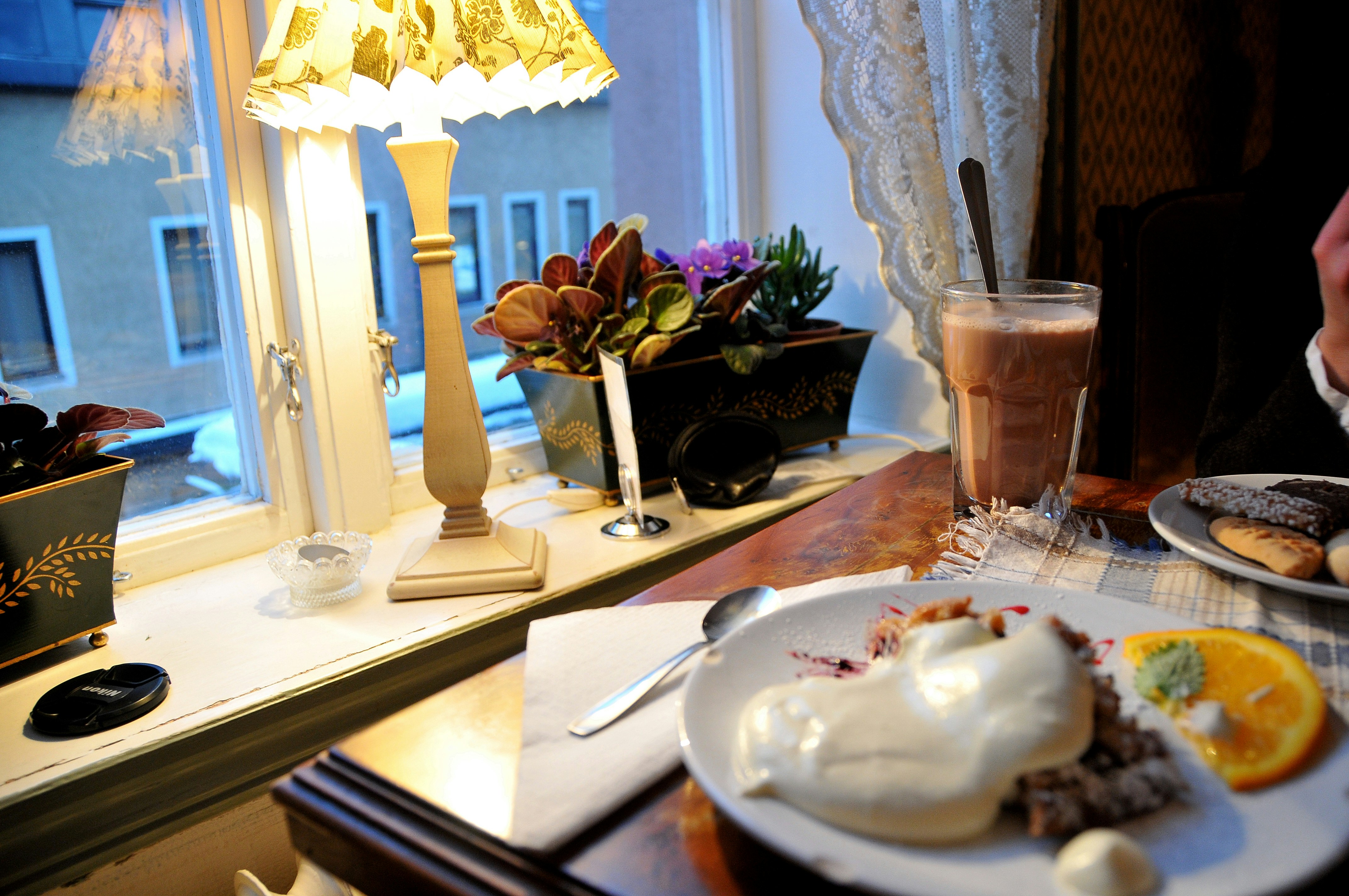 Sunlit Window Tabletop: A Cozy Café Moment with Foam, Citrus, and Milk froth