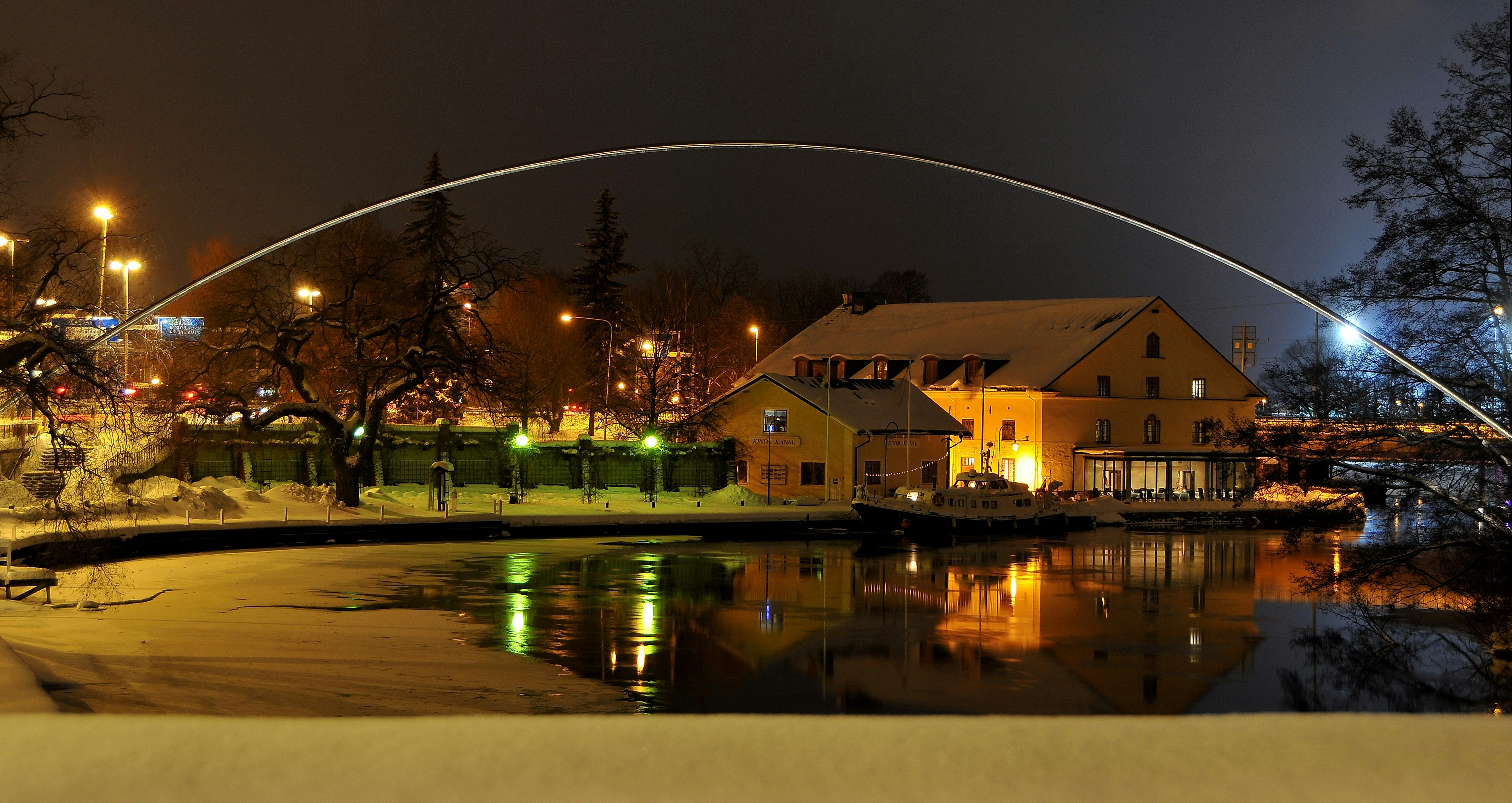 Arc of Night: A Lighted Bridge Sketch over a Quiet Harbor