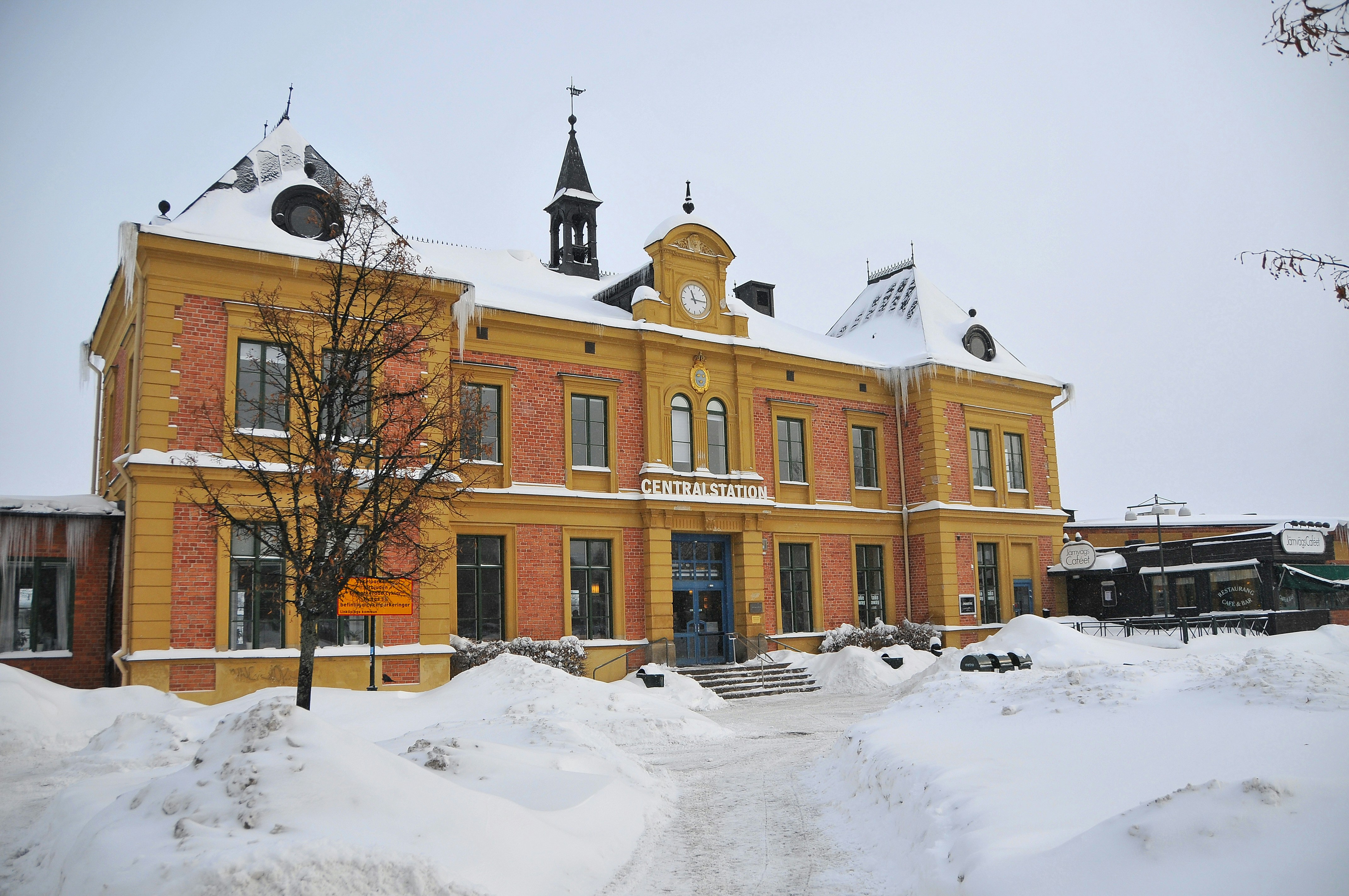 Clocktower Facade: A Snowbound Town Hall in Quiet Yellow