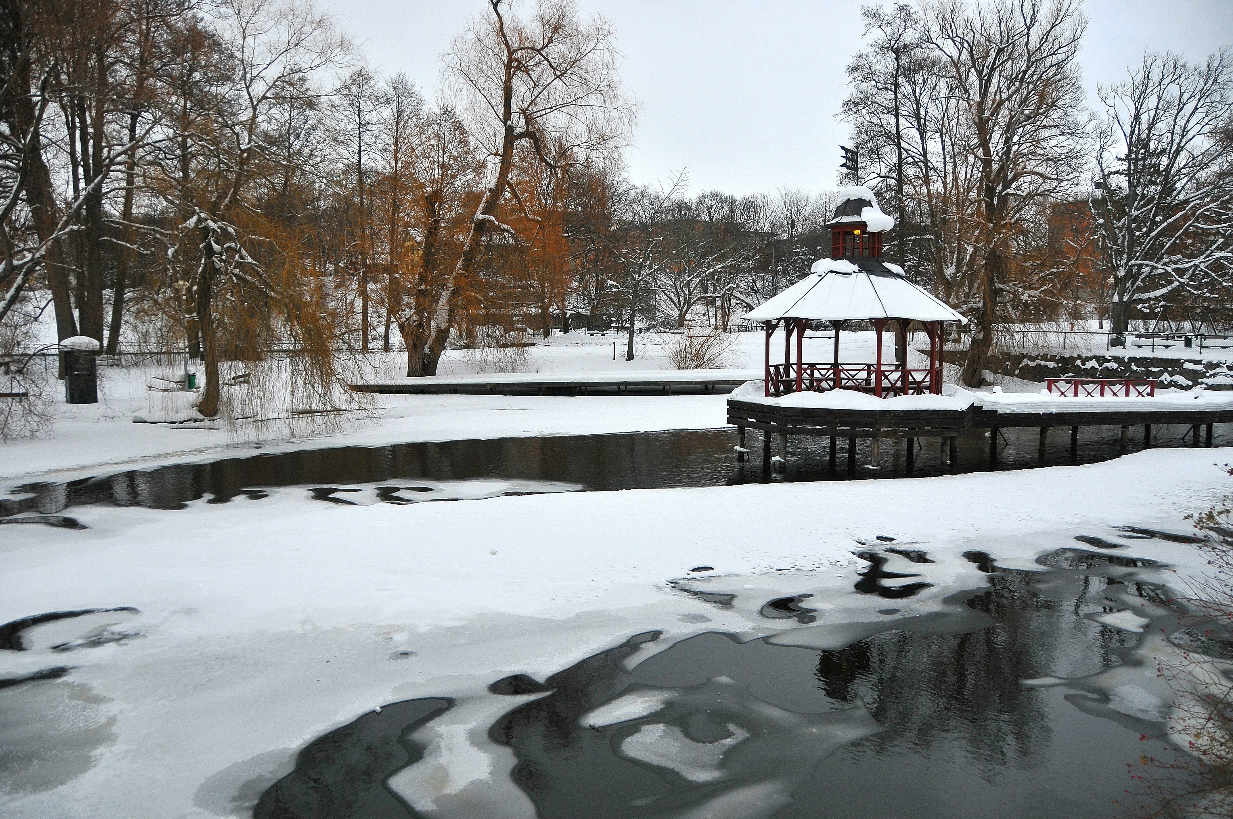 Snowbound Pavilion Over the Icy Pond