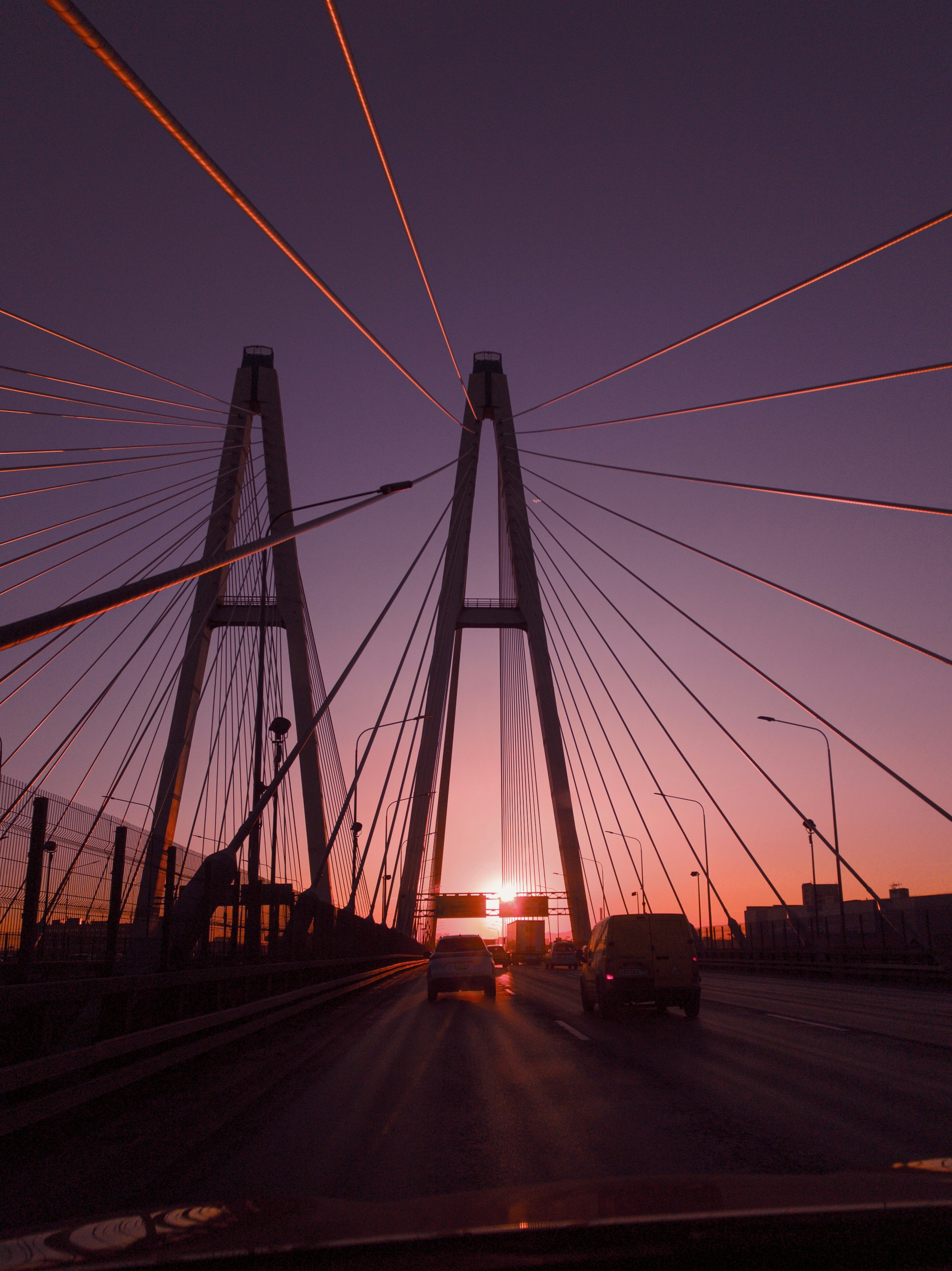 Sunset Spires: Cables, Cars, and a Glowing Horizon