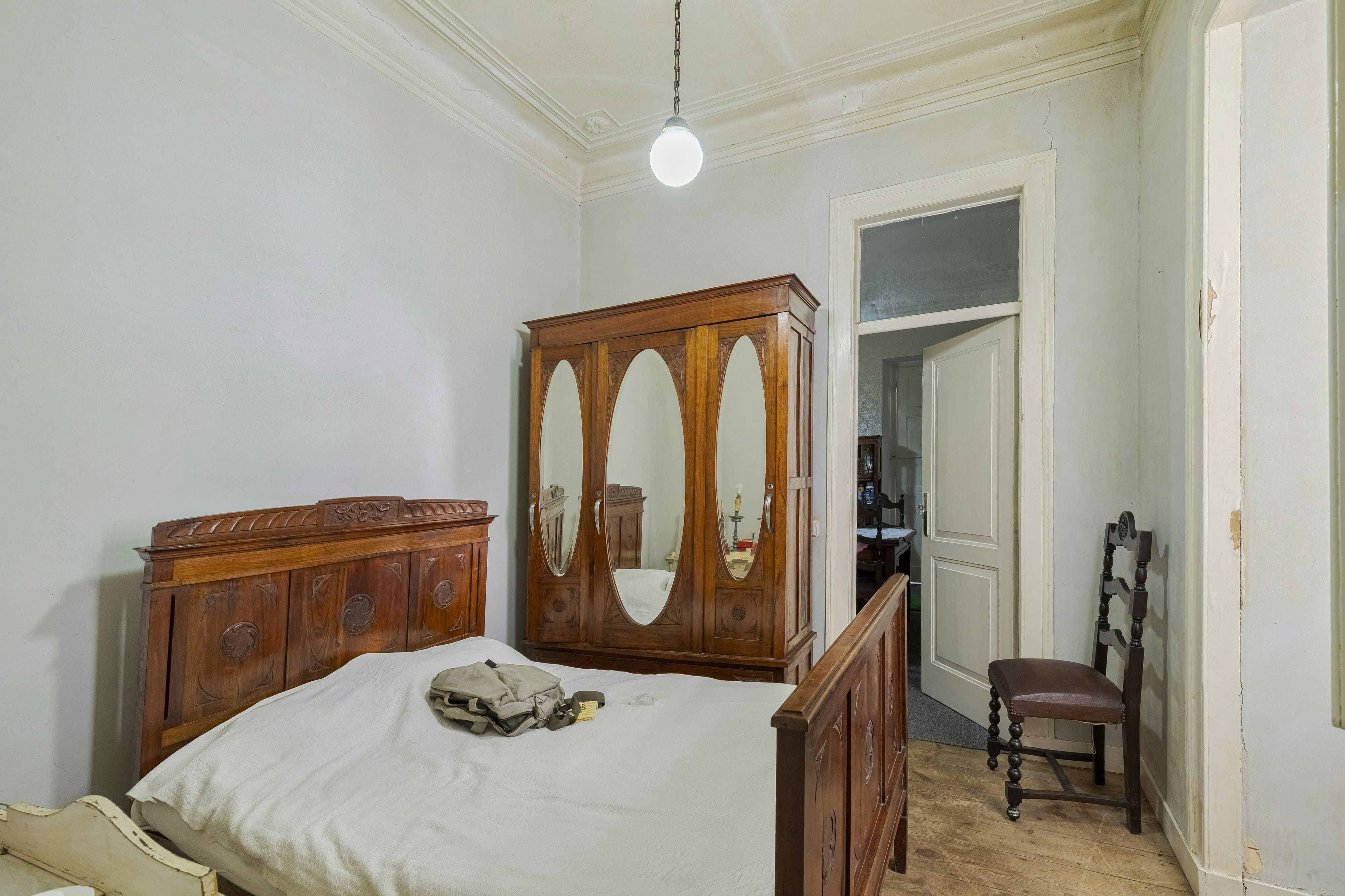 Dusty Bedchamber with Vintage Wardrobe and Echoes of Light