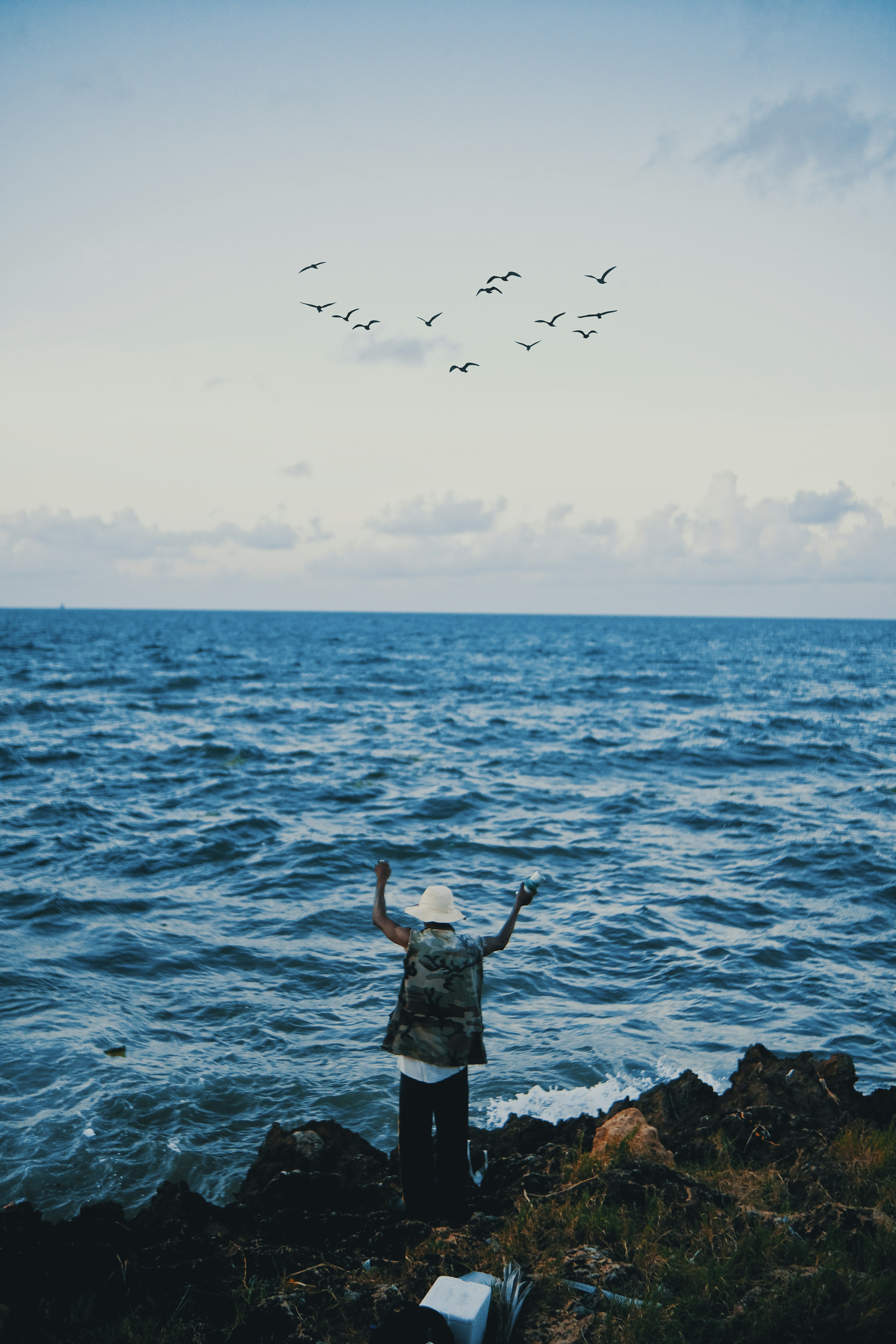 Raised Arms at Ocean Edge