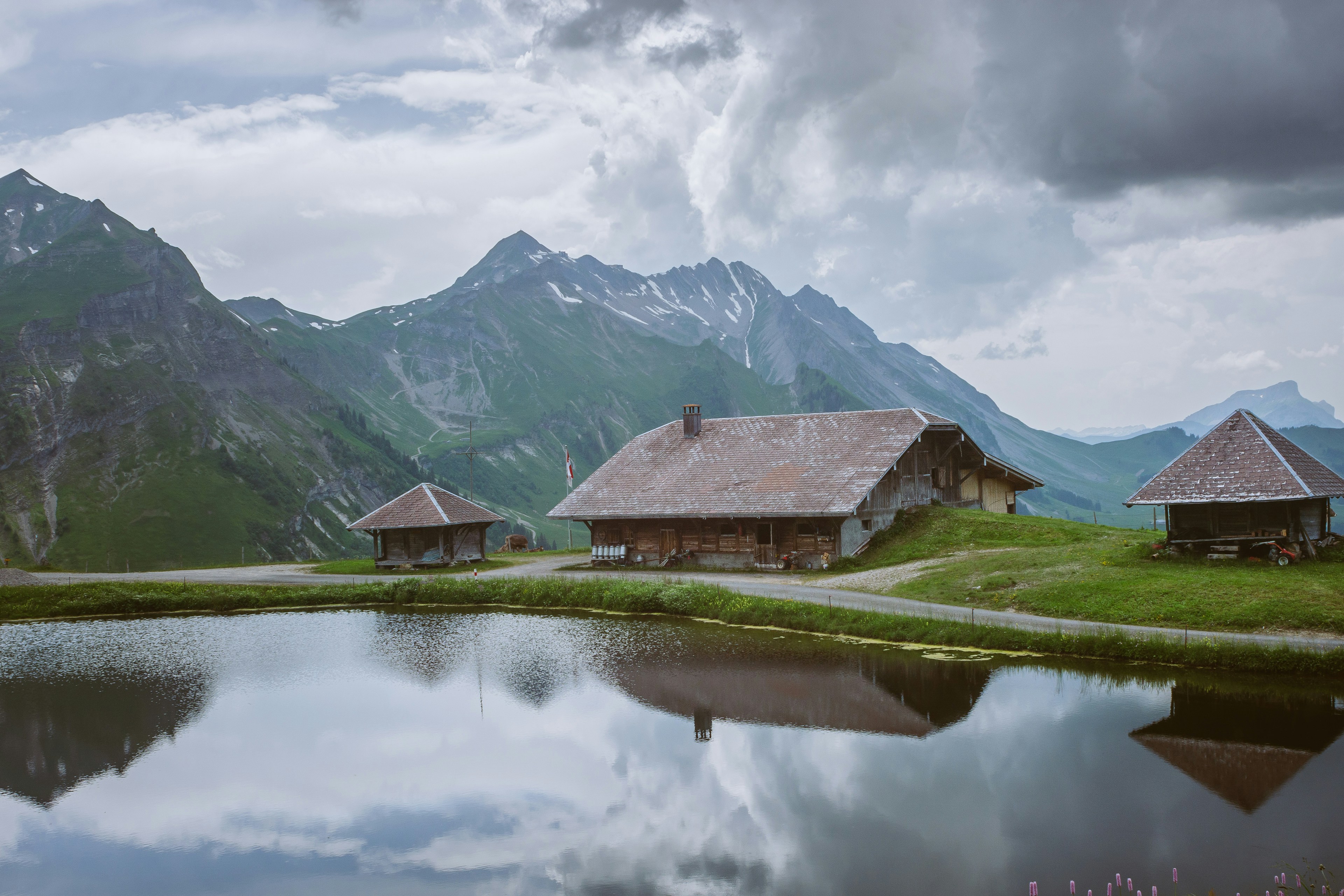 Lakeside Chalet Echoes: Quiet Peaks Under Clouded Skies
