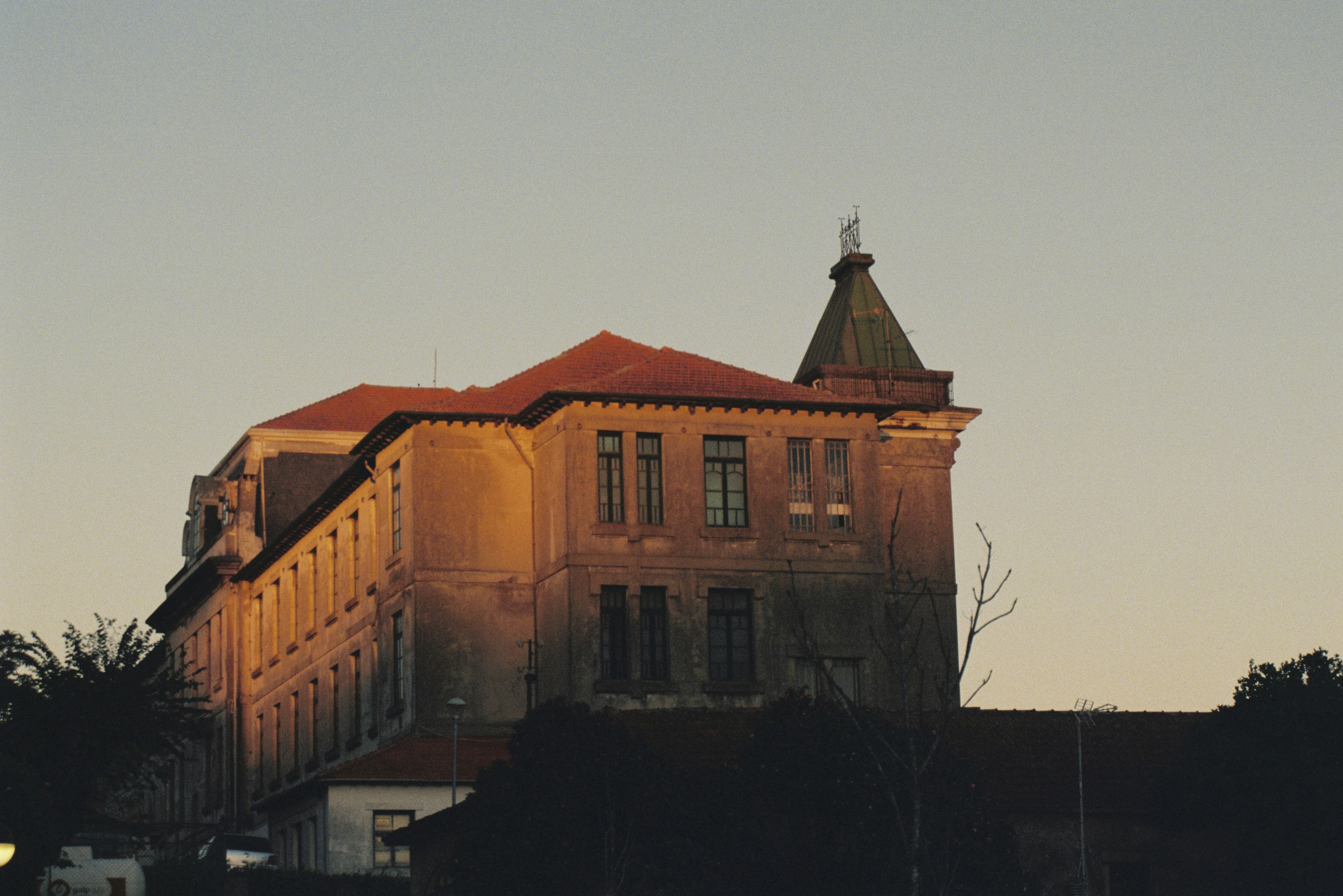 Sunlit Castle: An Old Brick Structure Bathed in Evening Light