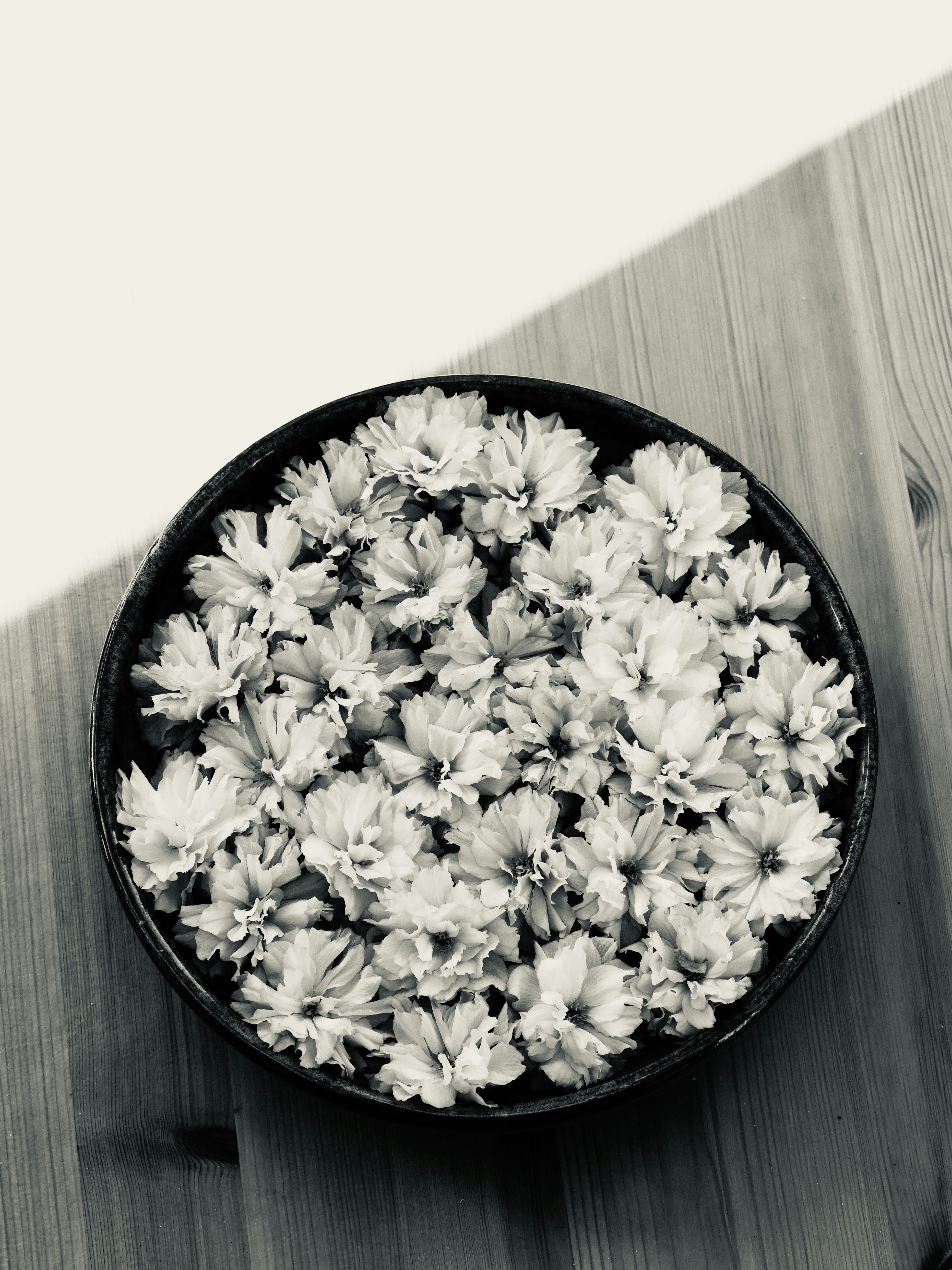 Round Bouquet in a Dark Bowl on a Wooden Table