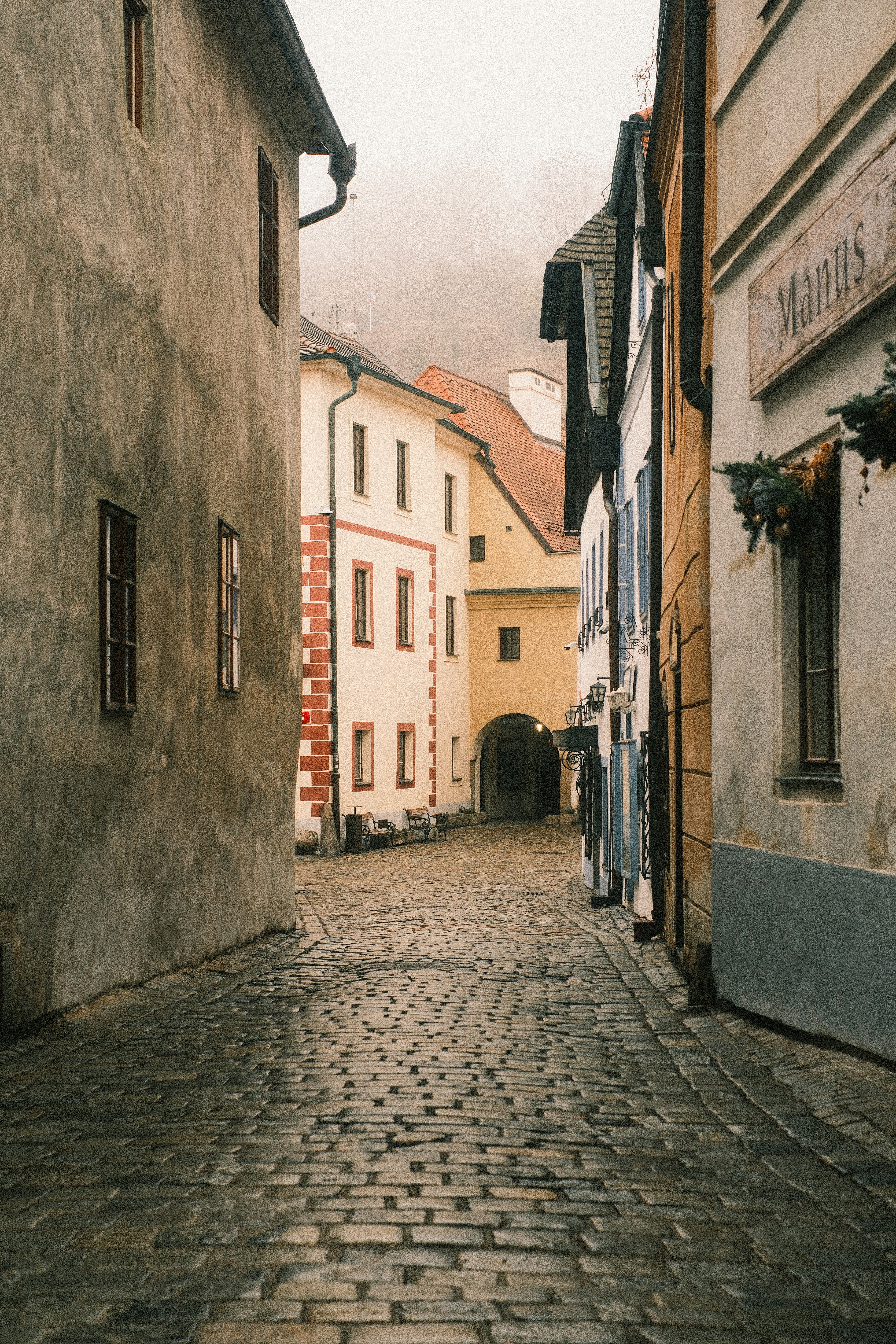Foggy European Alleyway Between Stuccoed Walls