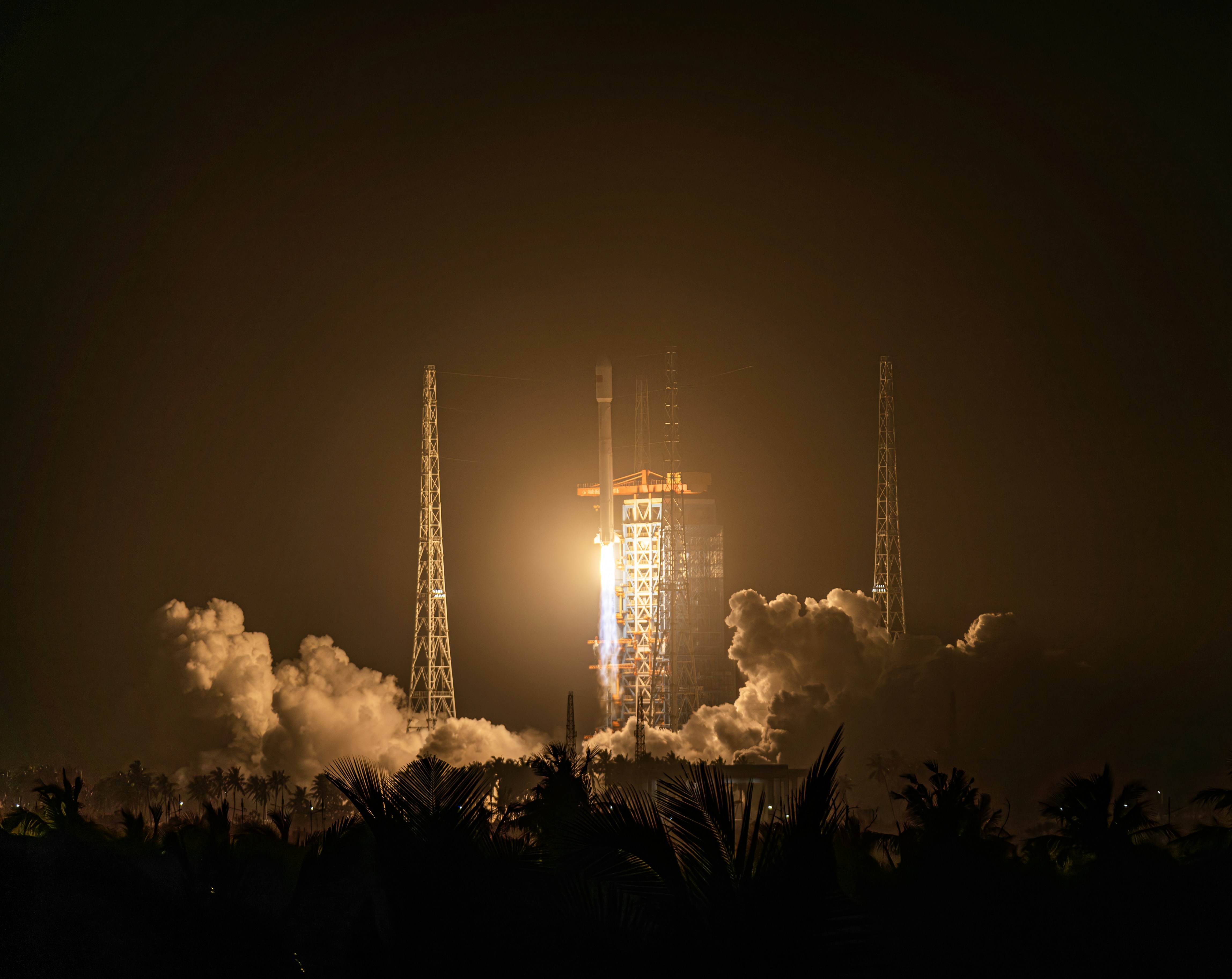 Luminous Ascent: Night Launch Illuminates the Horizon