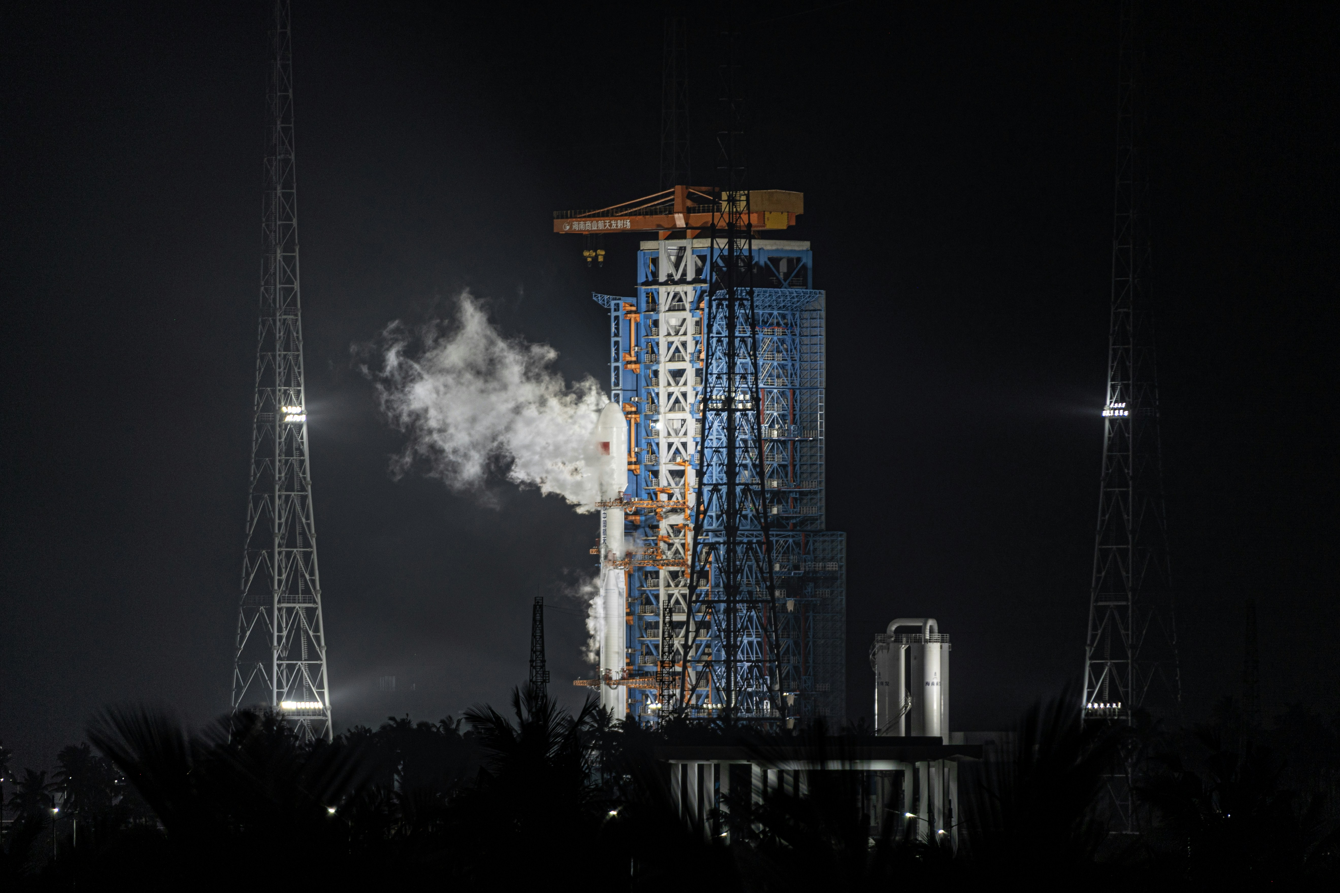 Night Launch Tower: Steam and Steel Under Moonlight