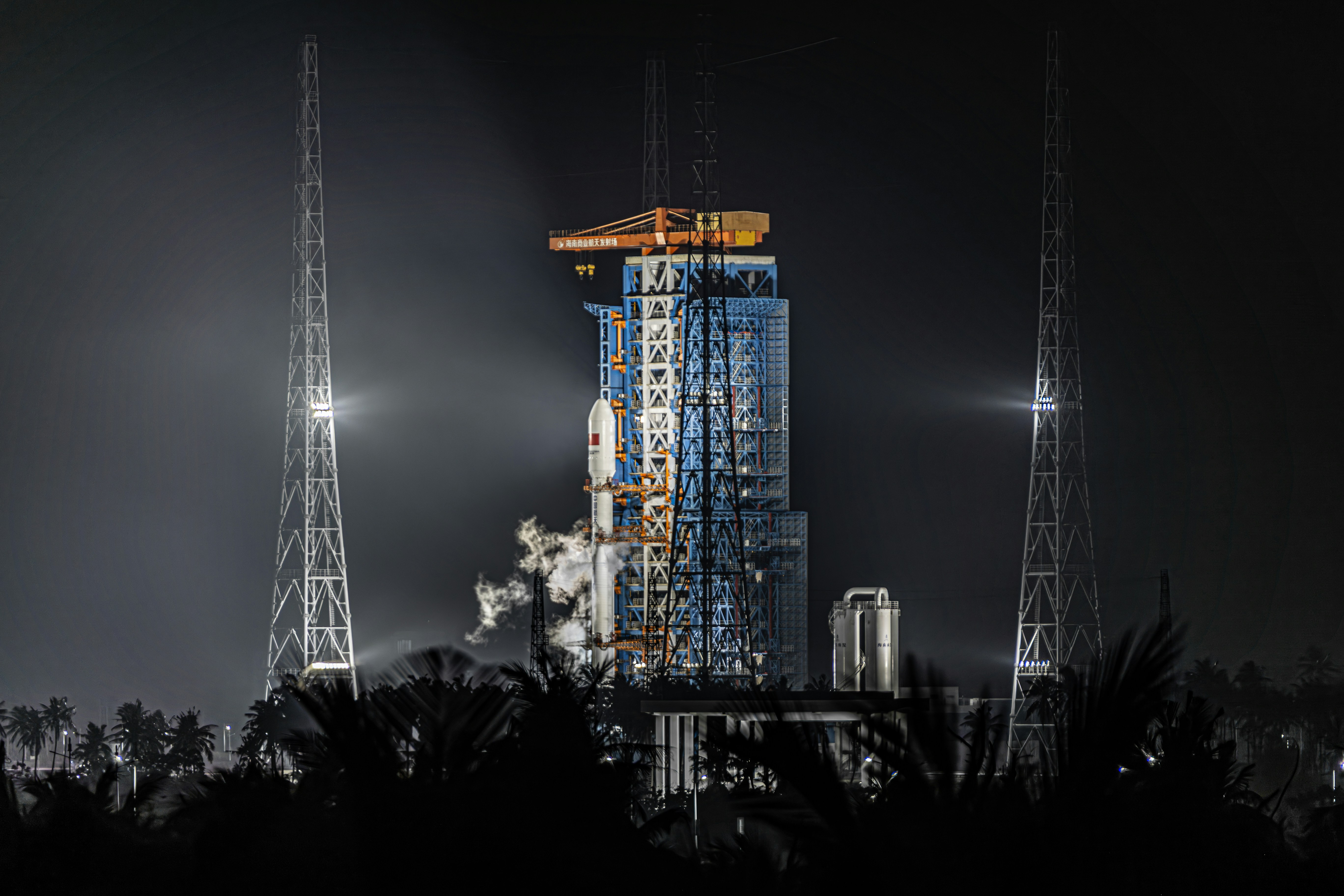 Night Launch: A Towering Silhouette Against the Night Sky