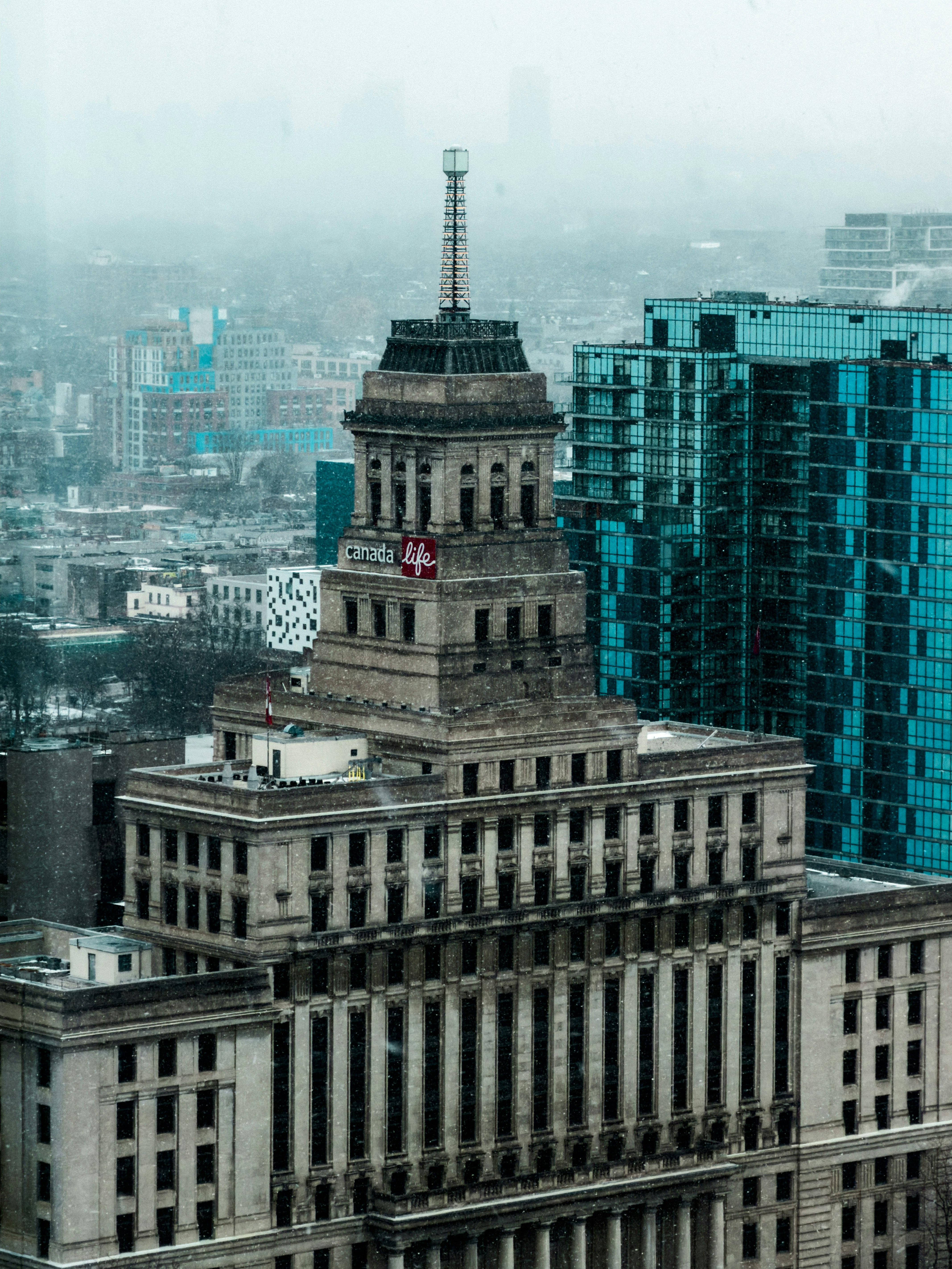 Towering Beacon in a Snowy Cityscape