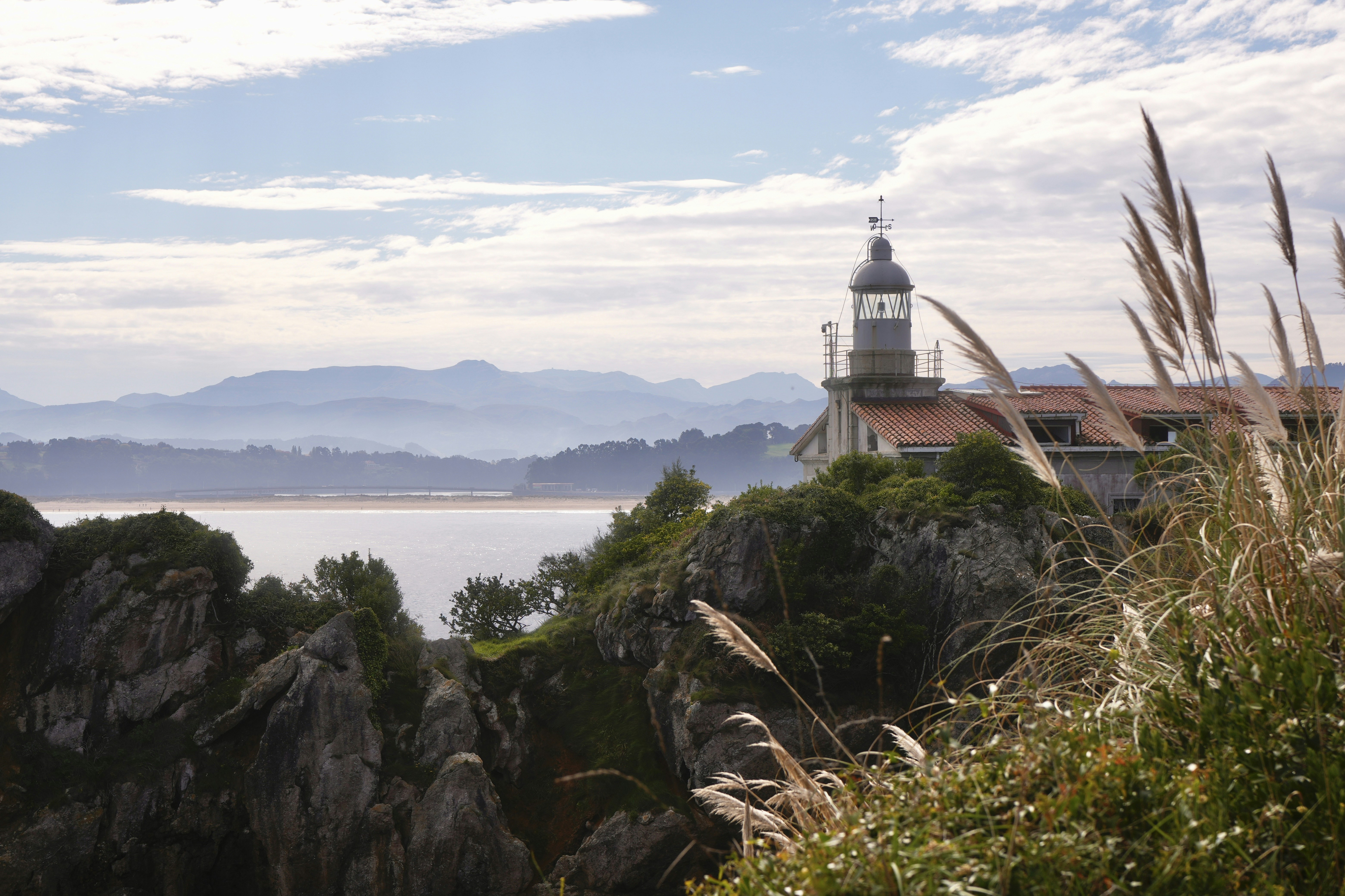 Lighthouse on Coastal Cliffs Under a Quiet Sky