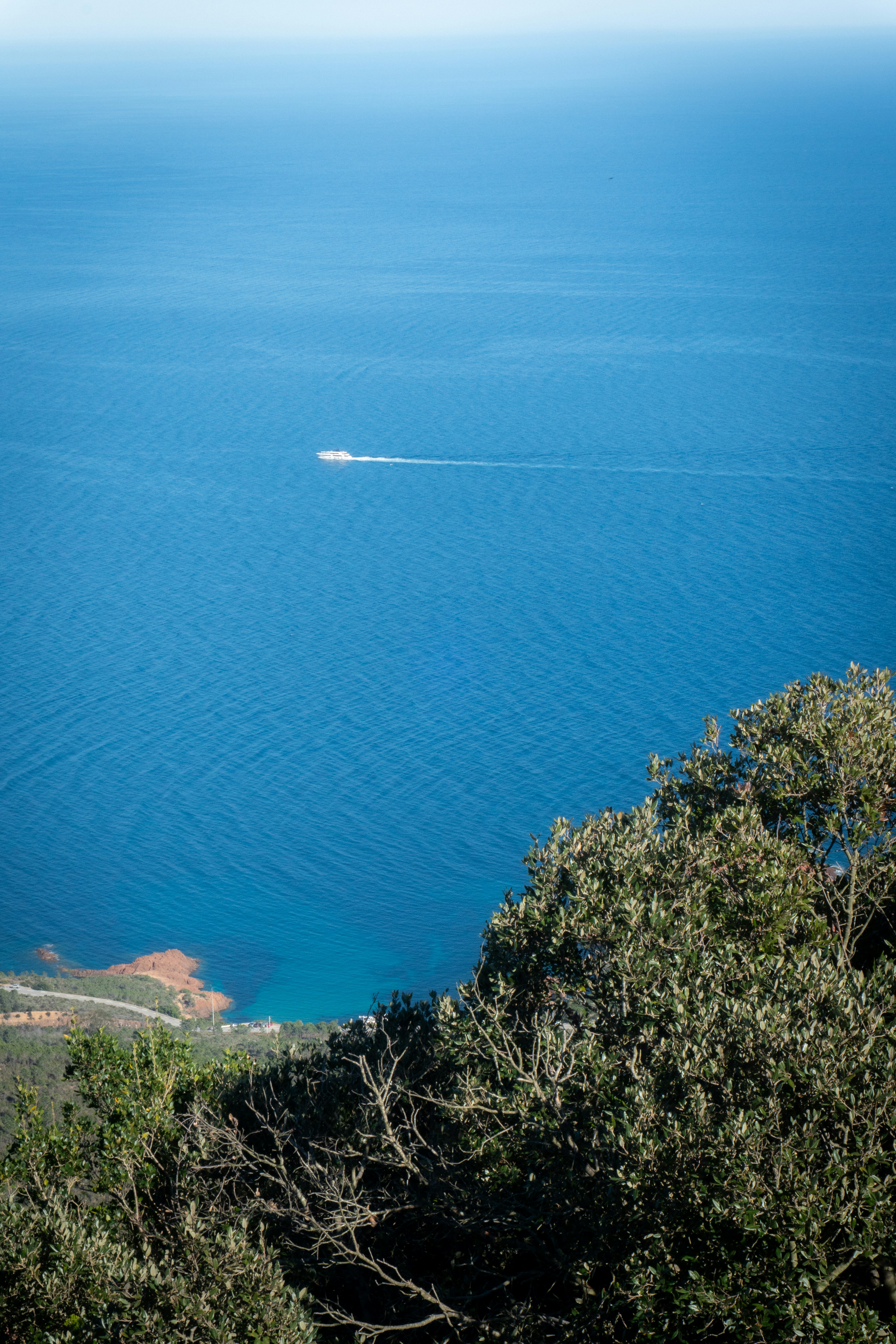 Blue Expanse: A Quiet Vessel Across Open Sea
