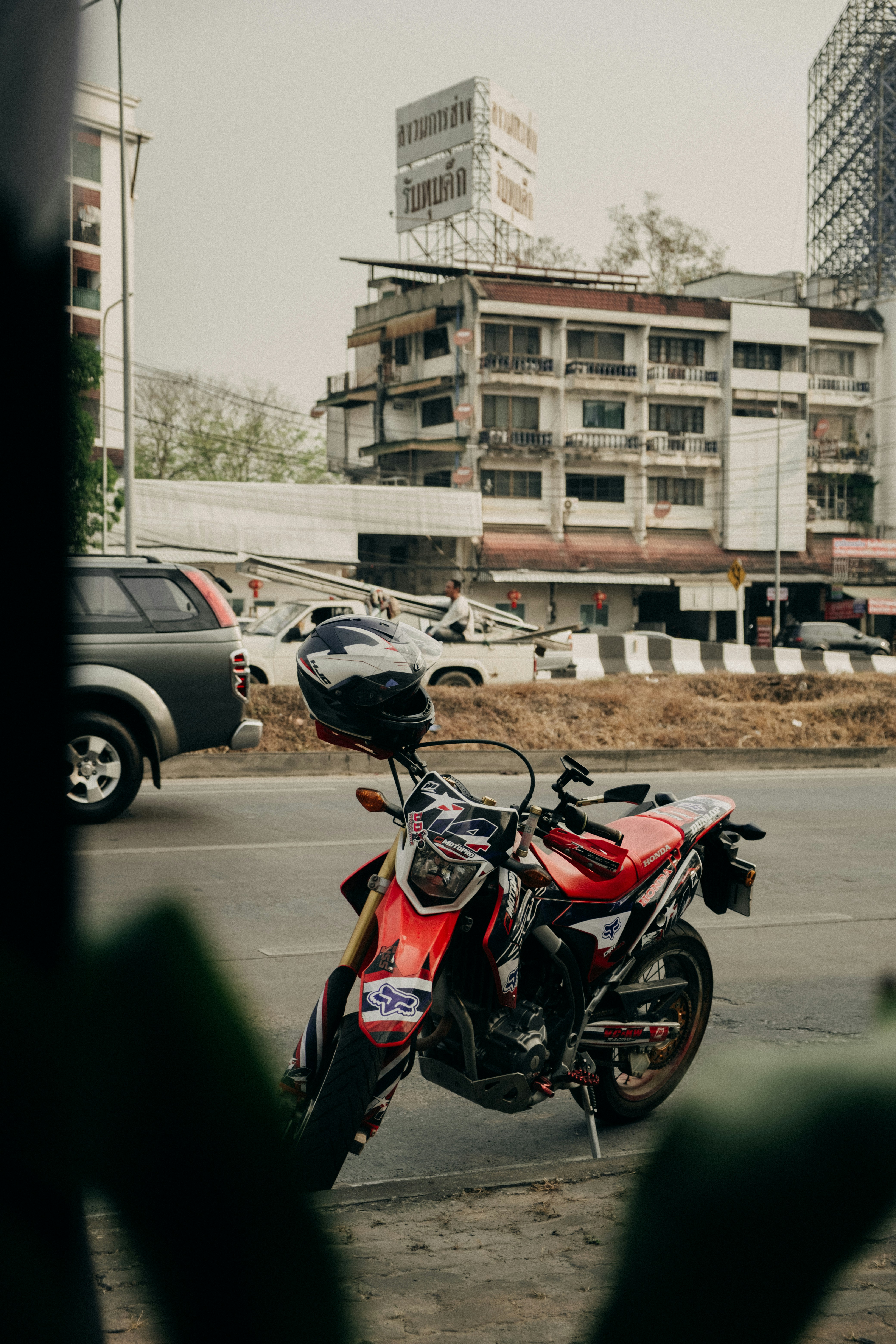 Red Moto at the Roadside Edge