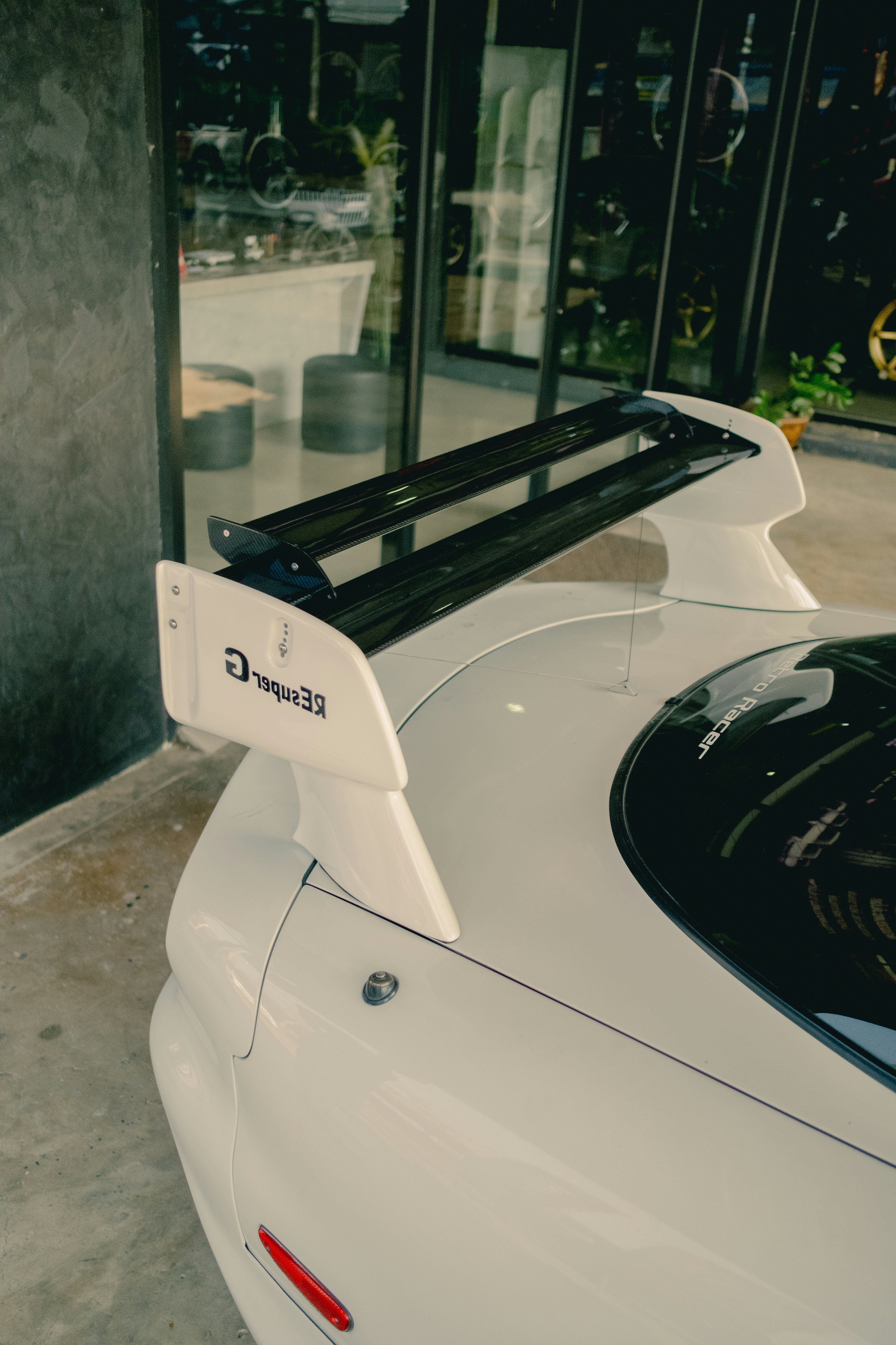 The White Wild Wings: A Racecar's Aerodynamic Wing Silhouette