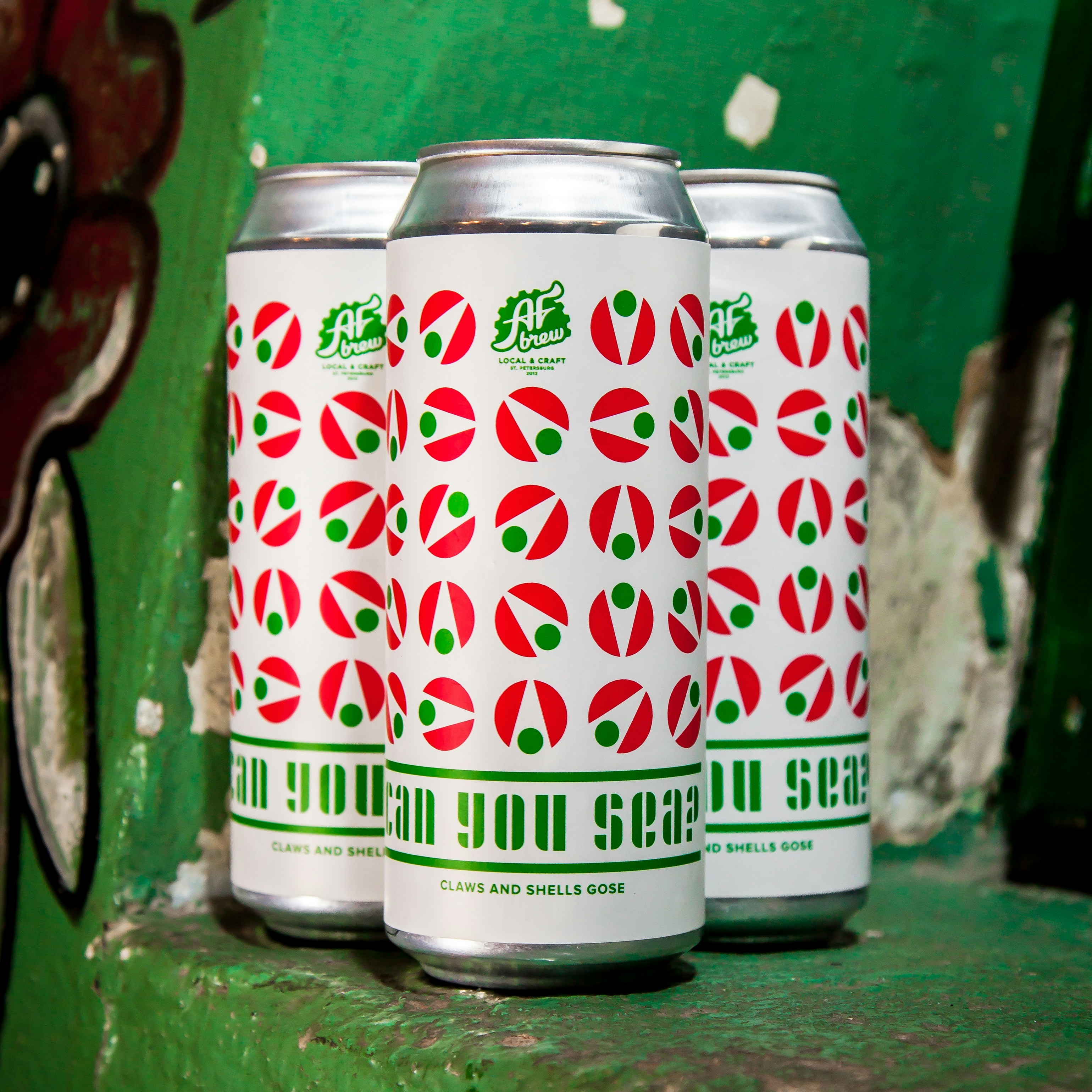 Vivid Coral Canisters: A Trio of Clashing Green and White Packaging