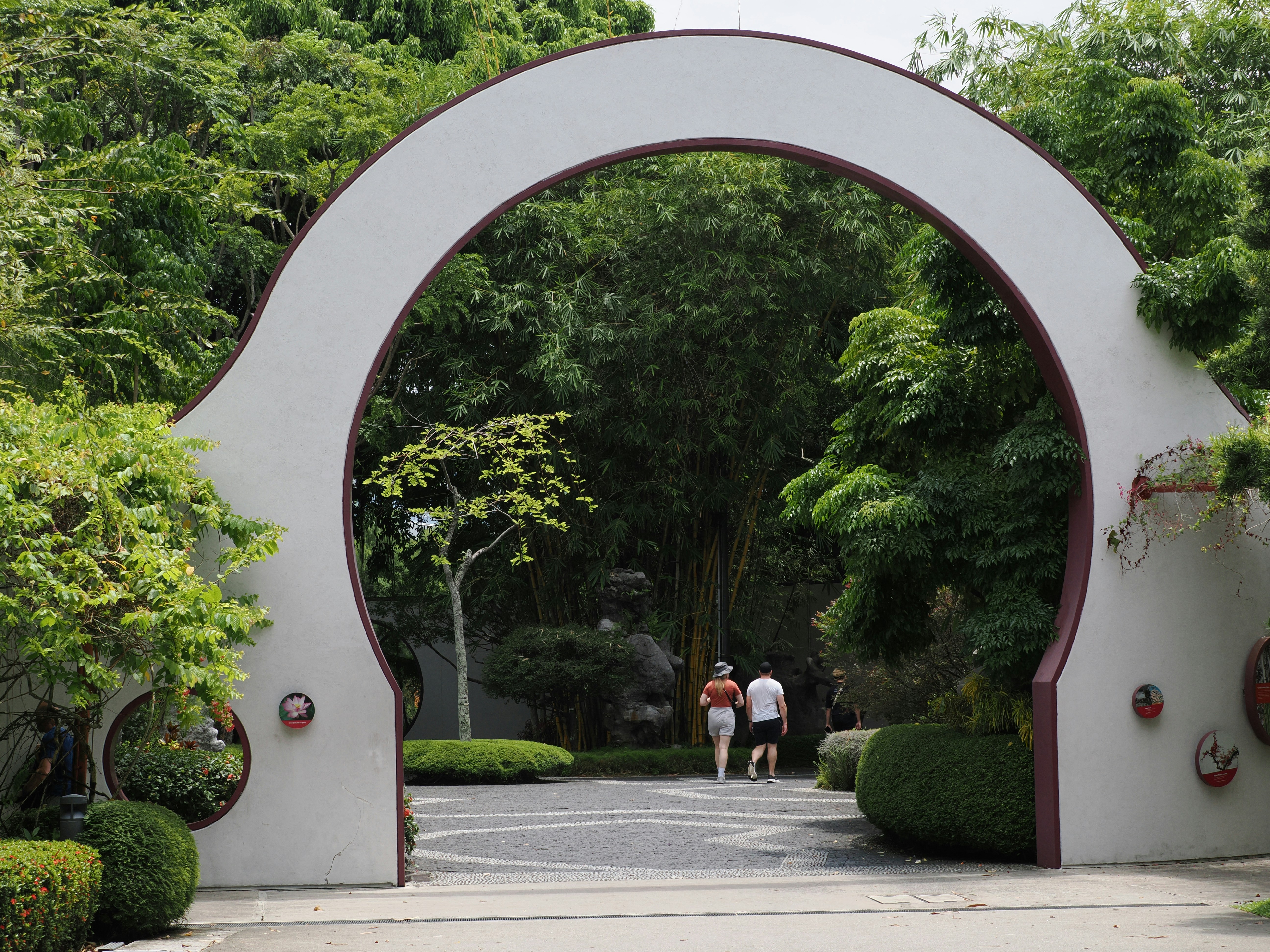 Gateway to Serenity: A Circular Arch Framing a Quiet Park Path