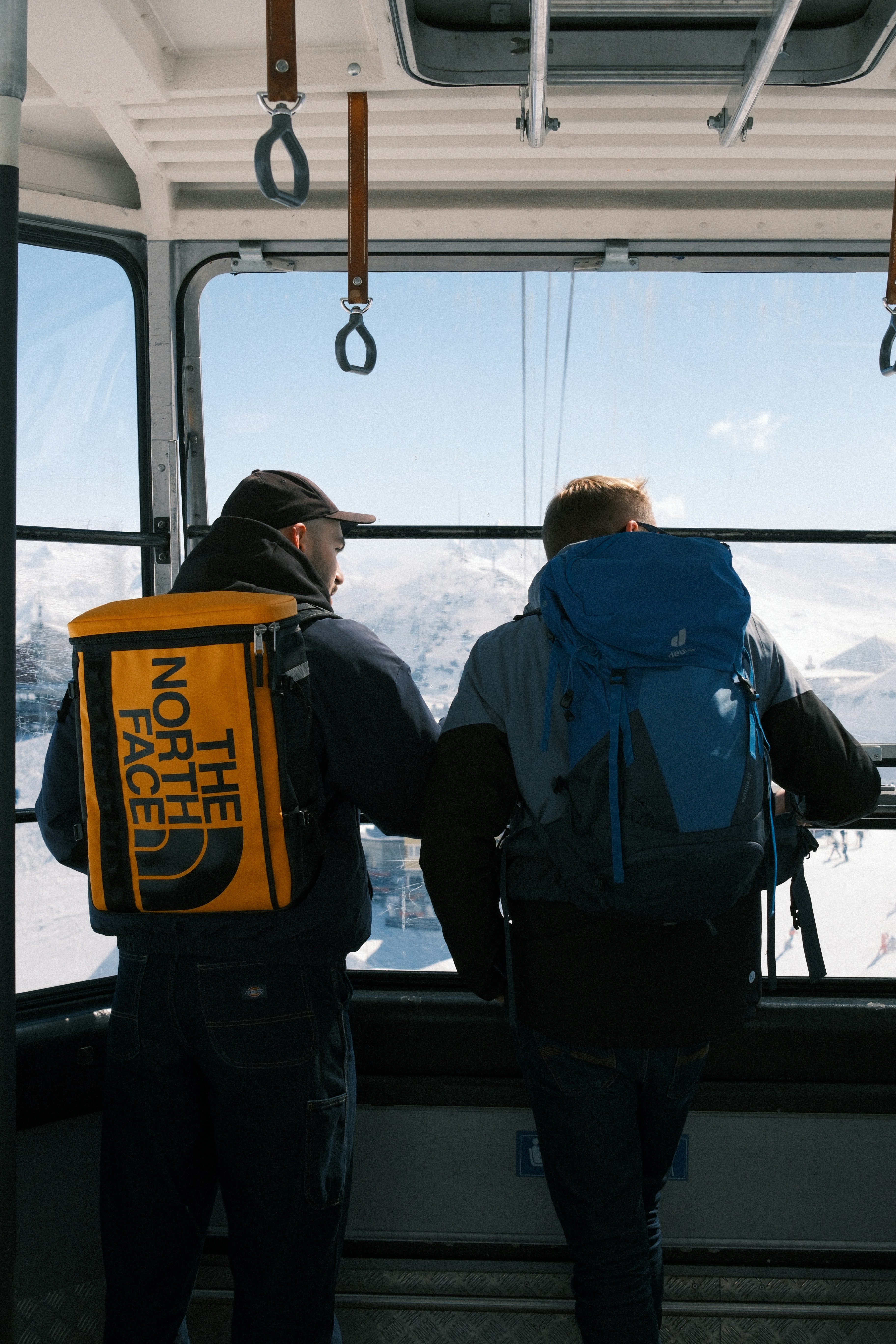 Ridge-line Ascent: Cable-car View from Behind Two Climbers