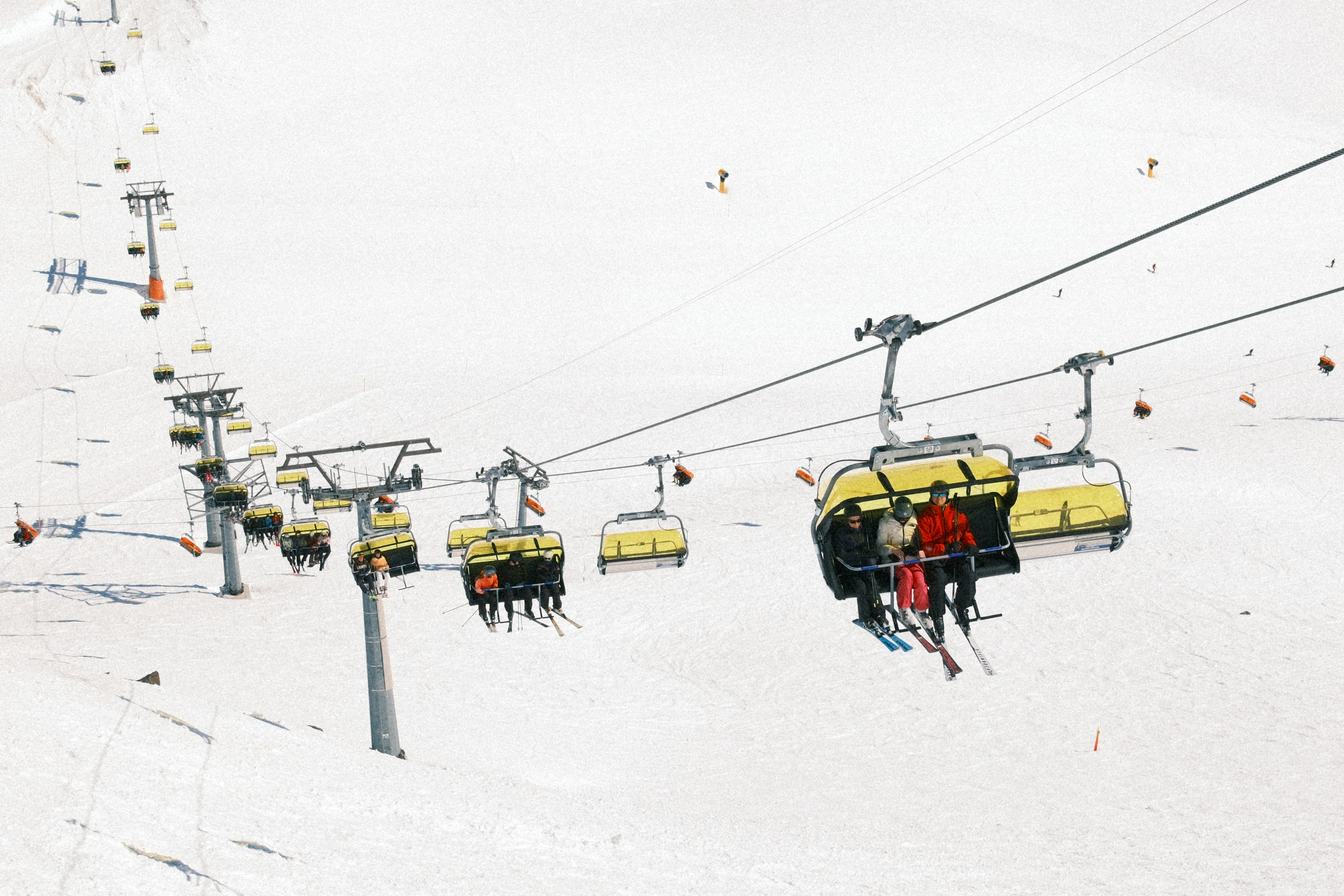 Ski Lift in Silent White: A Row of Chairs Across the Snowfield