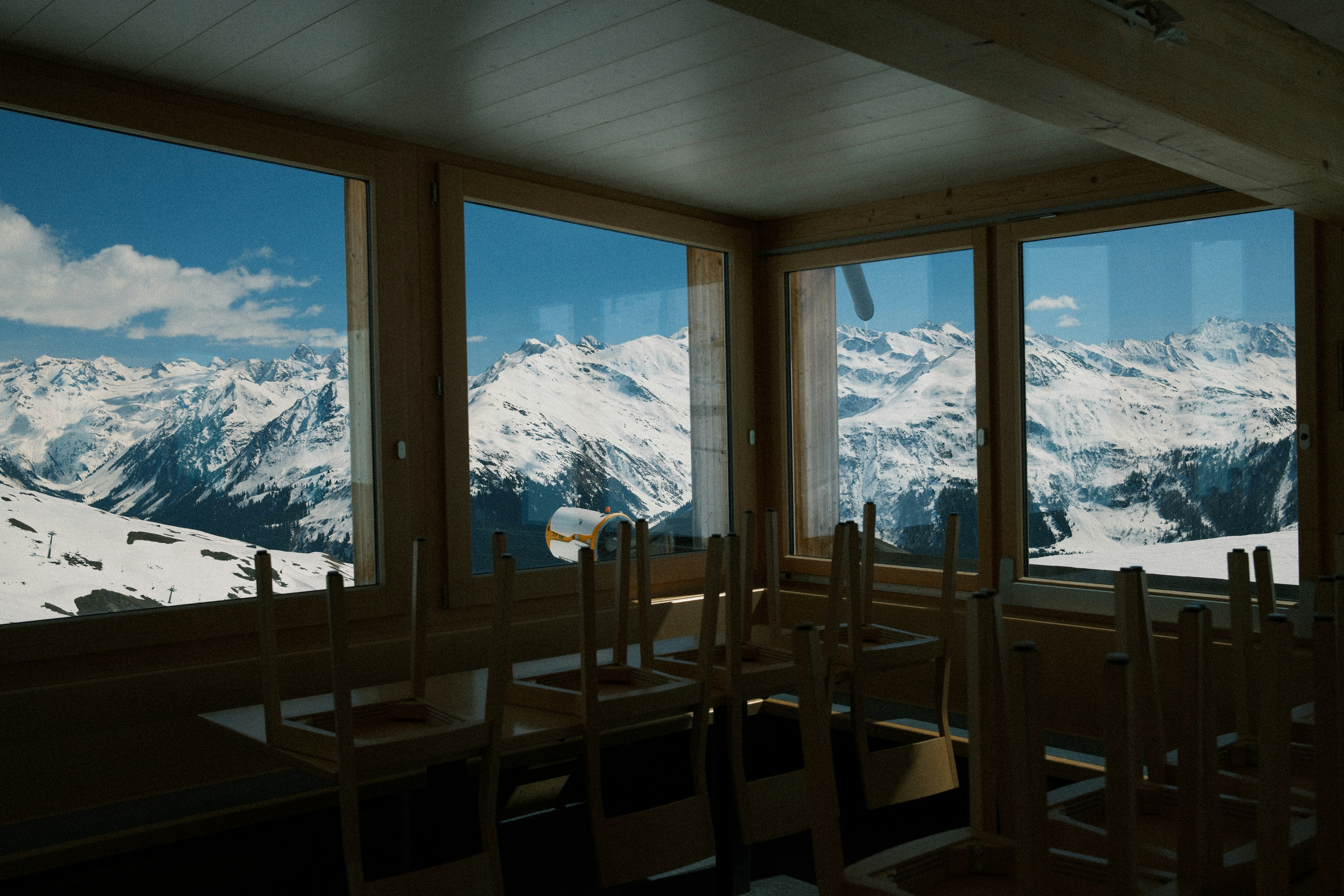 Snow-lit Alpine Vista Framed by a Quiet Café