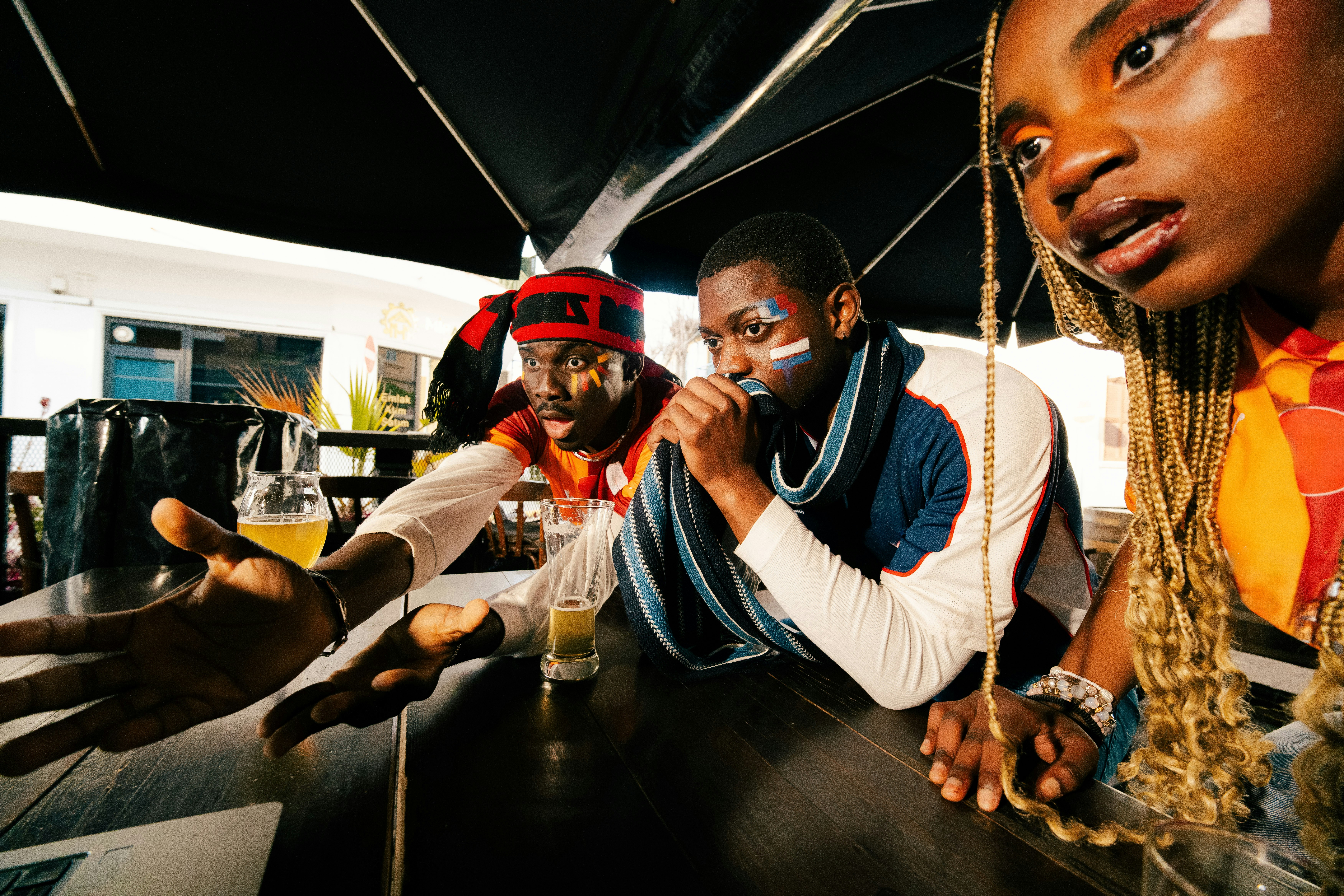 Crowd at a lively bar: reaching hands and masked friends in a crowded moment