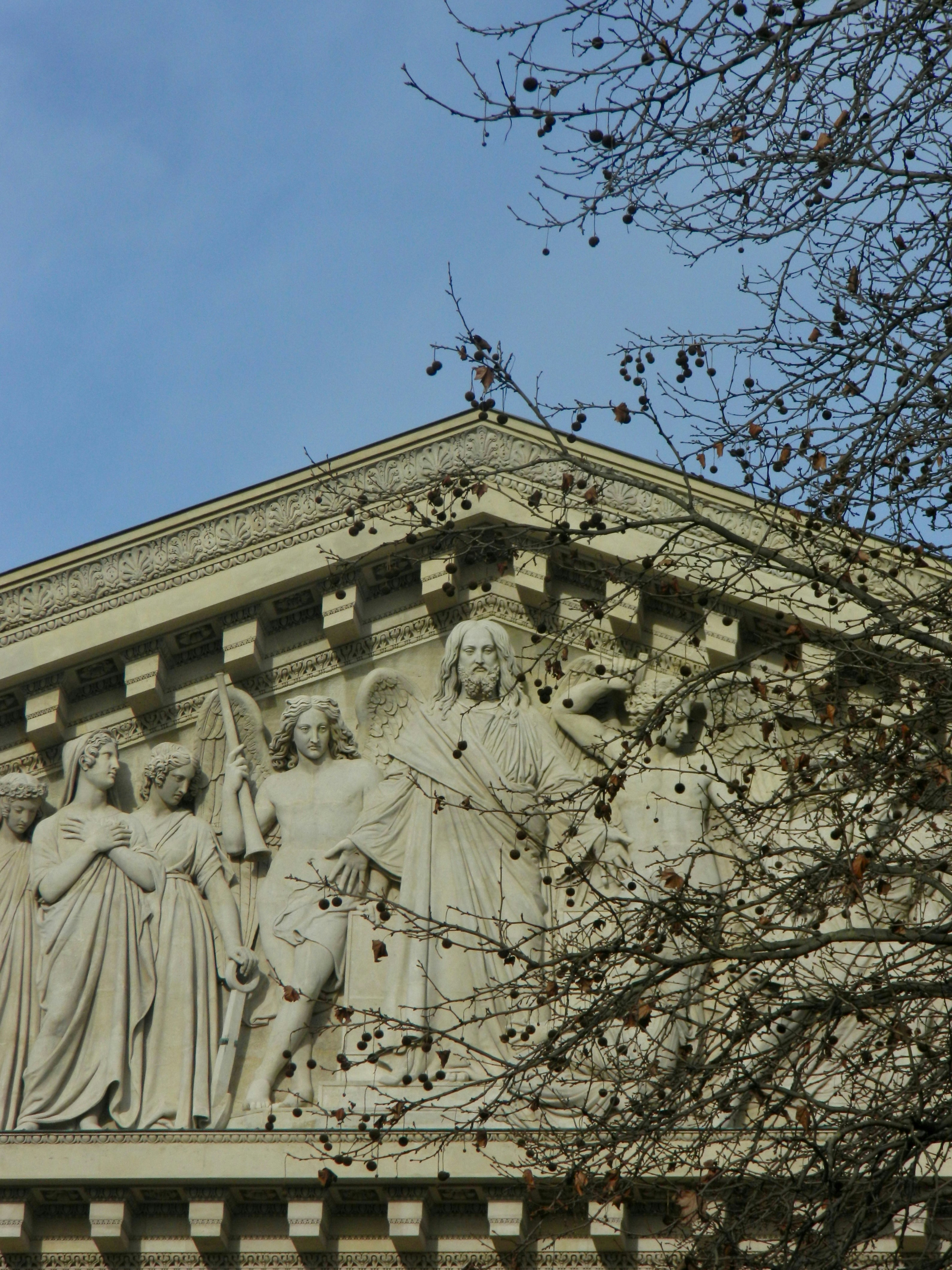Relief of Historic Figures Framing a Classical Pediment