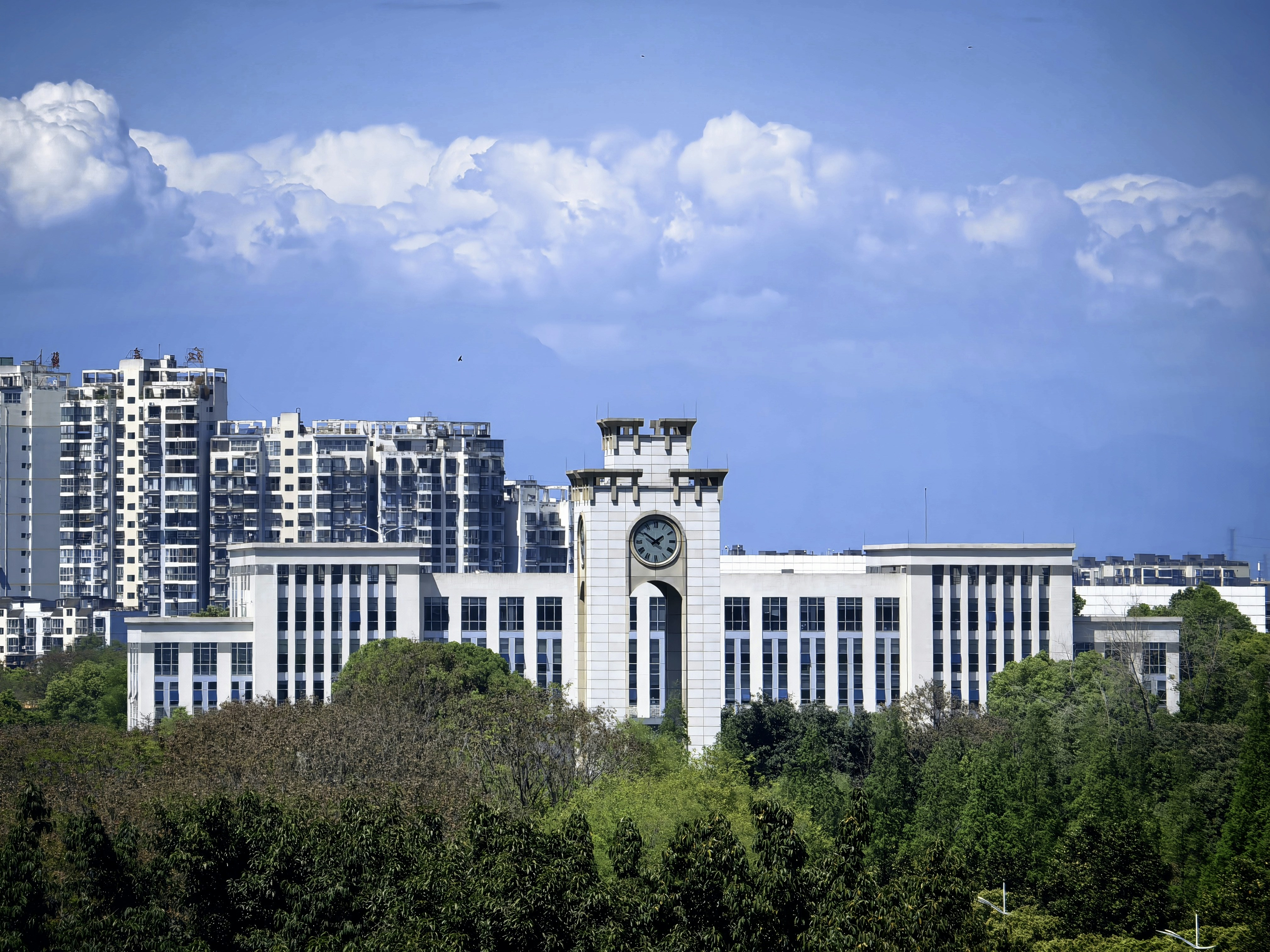 Clocktower Campus Rising Over a Green Belt