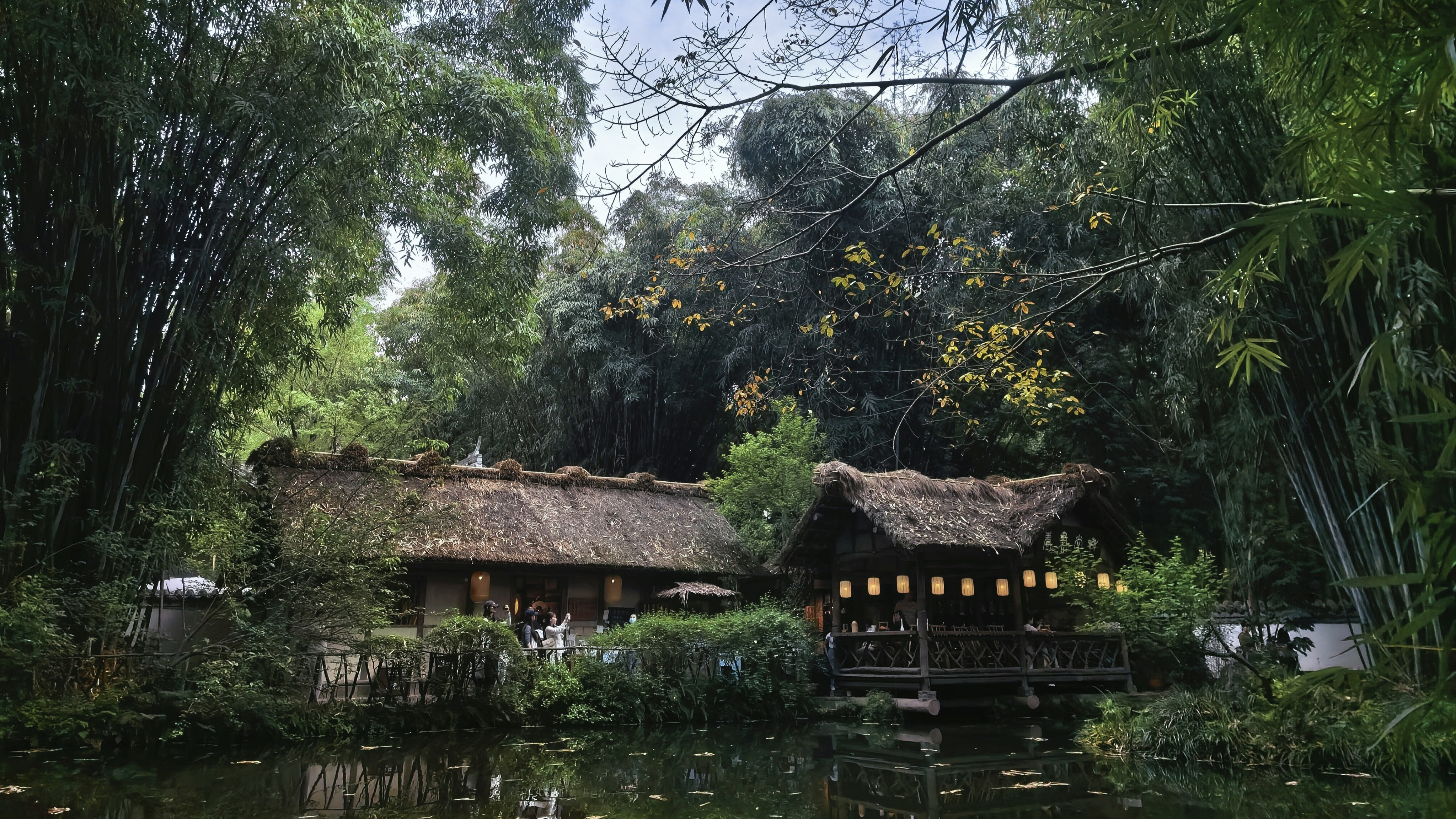 Tranquil Riverside Teahouse Amid Bamboo Forest