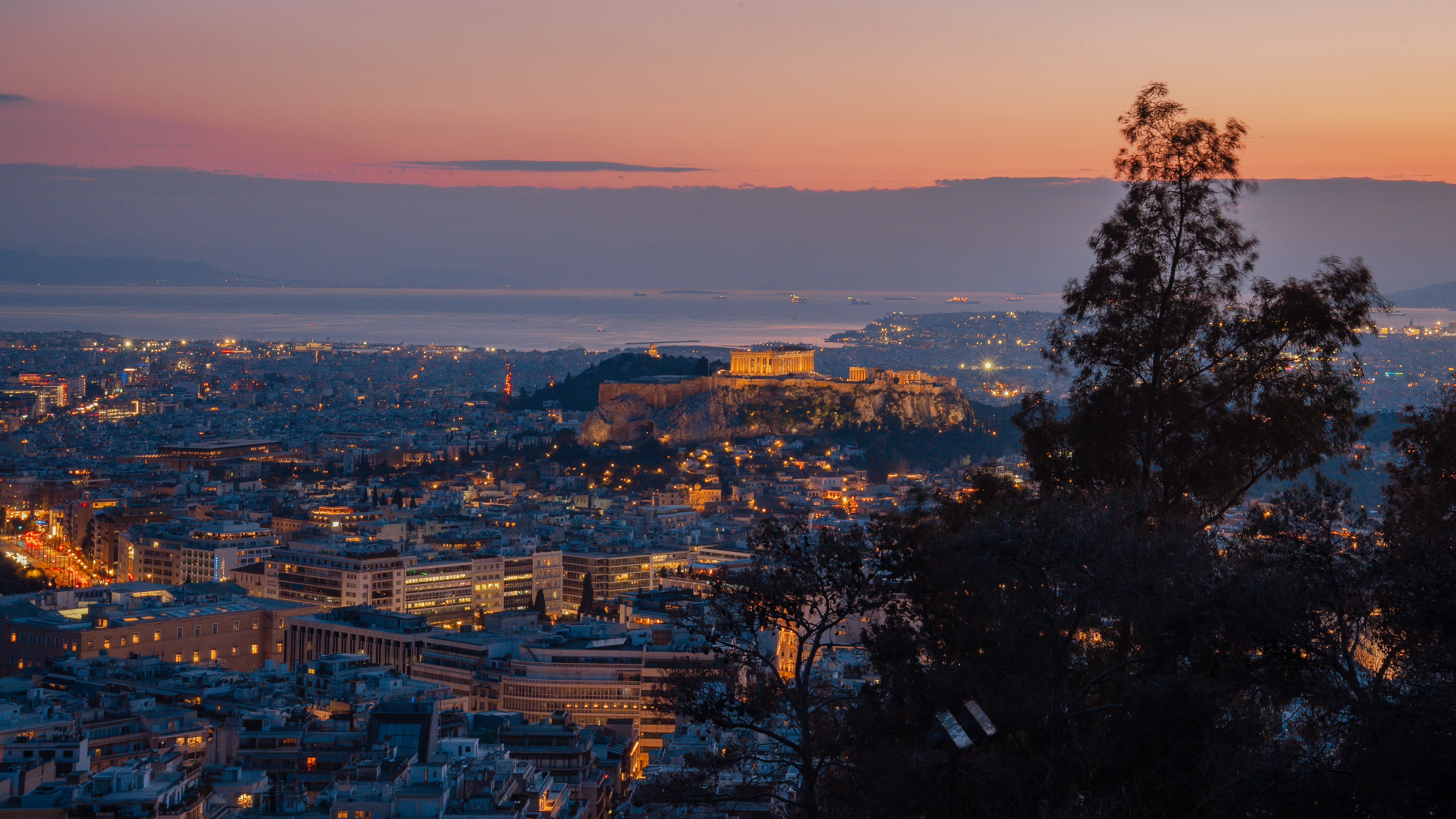 Dusk Over the Hills: City Lights Beneath a Quiet Horizon
