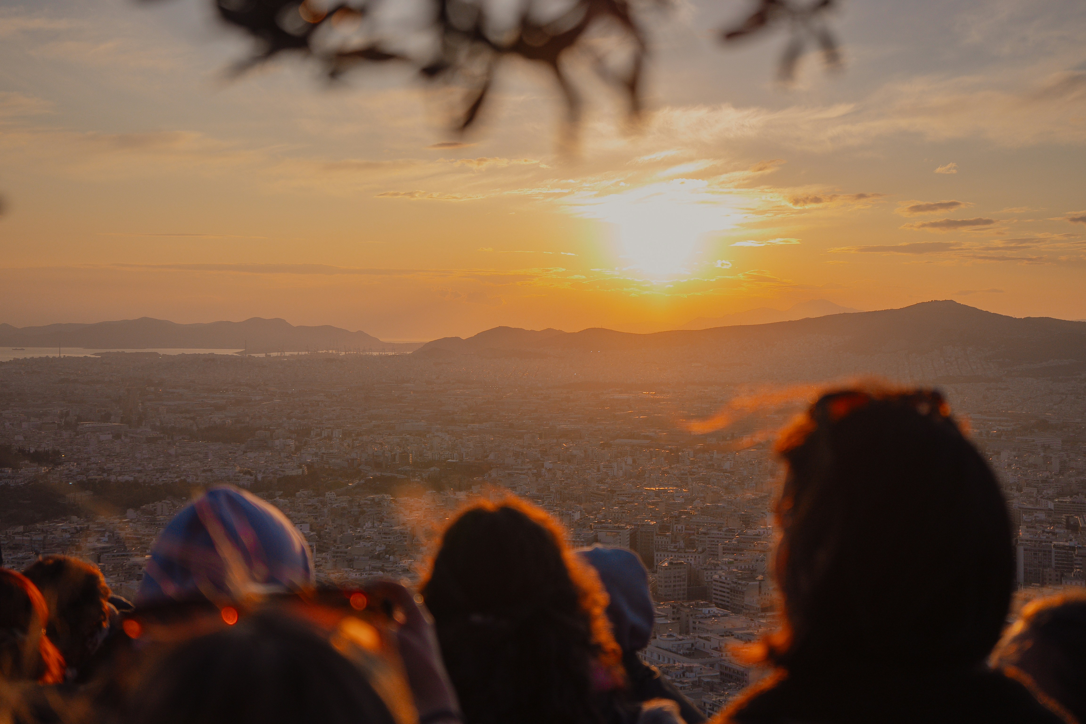 Sunset Overlook: A Crowd Silhouetted at the Horizon