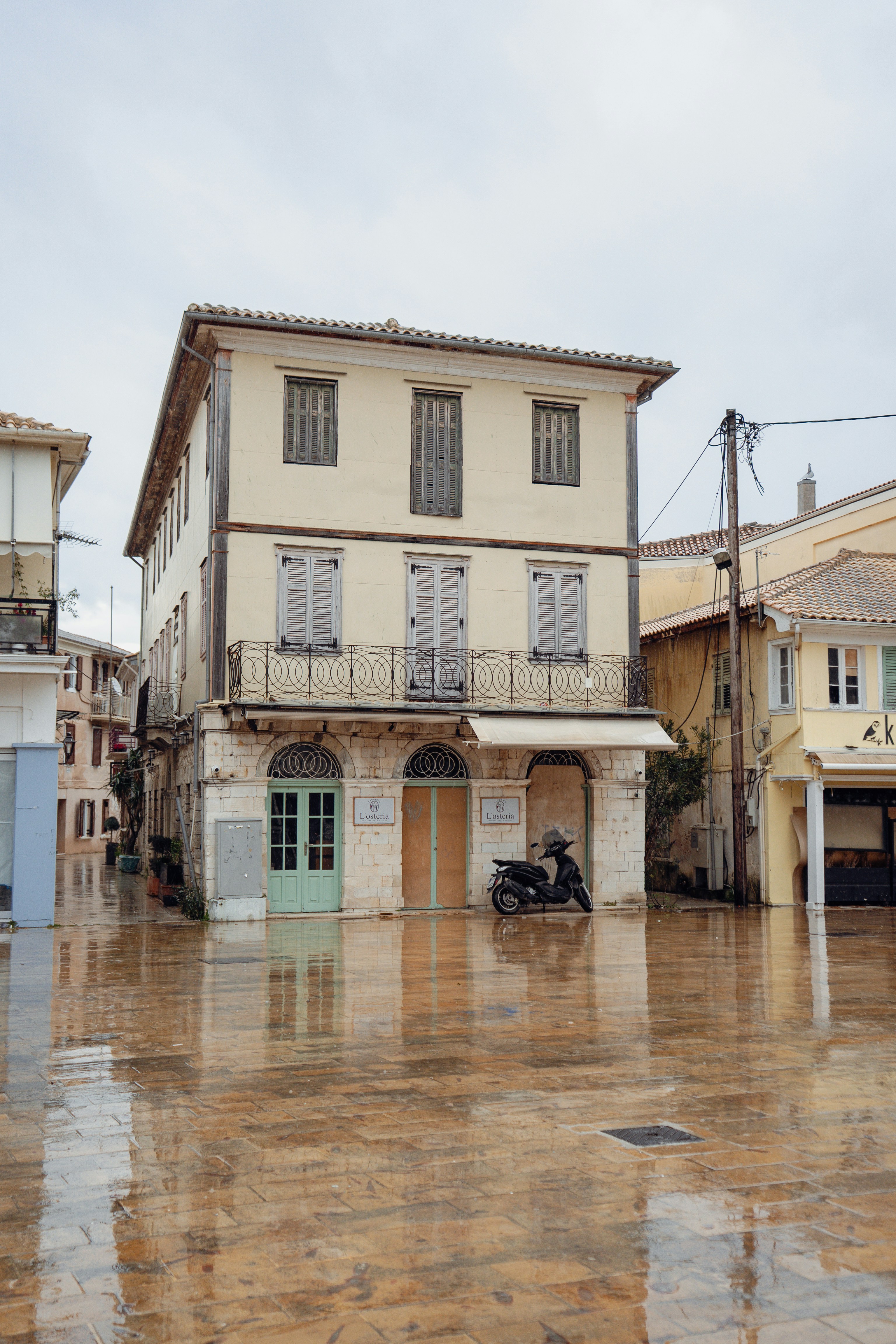 Italianate Cornerhouse on a Rain-Slick Piazza