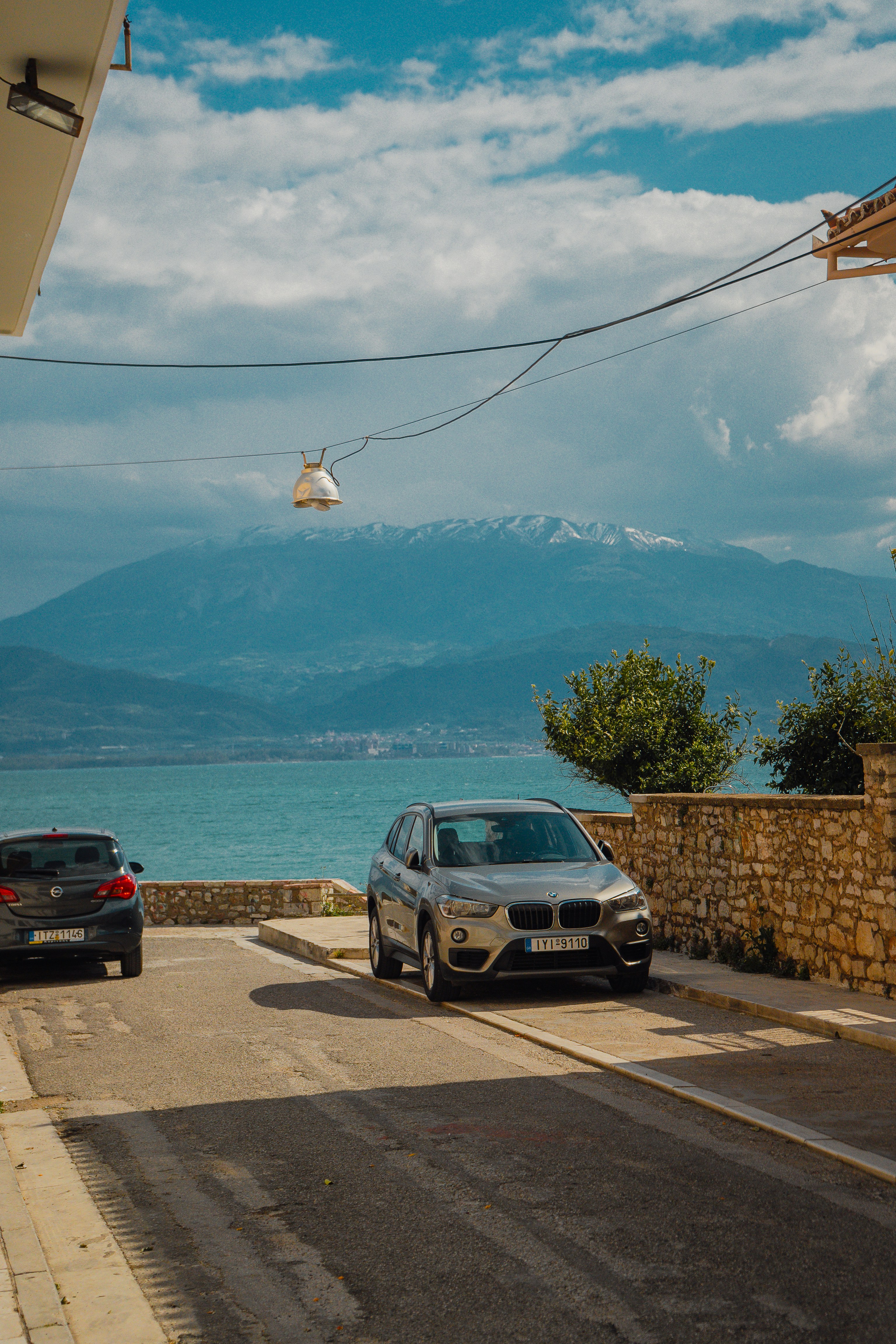 Coastal Roadside Pause Under Alpine Sky