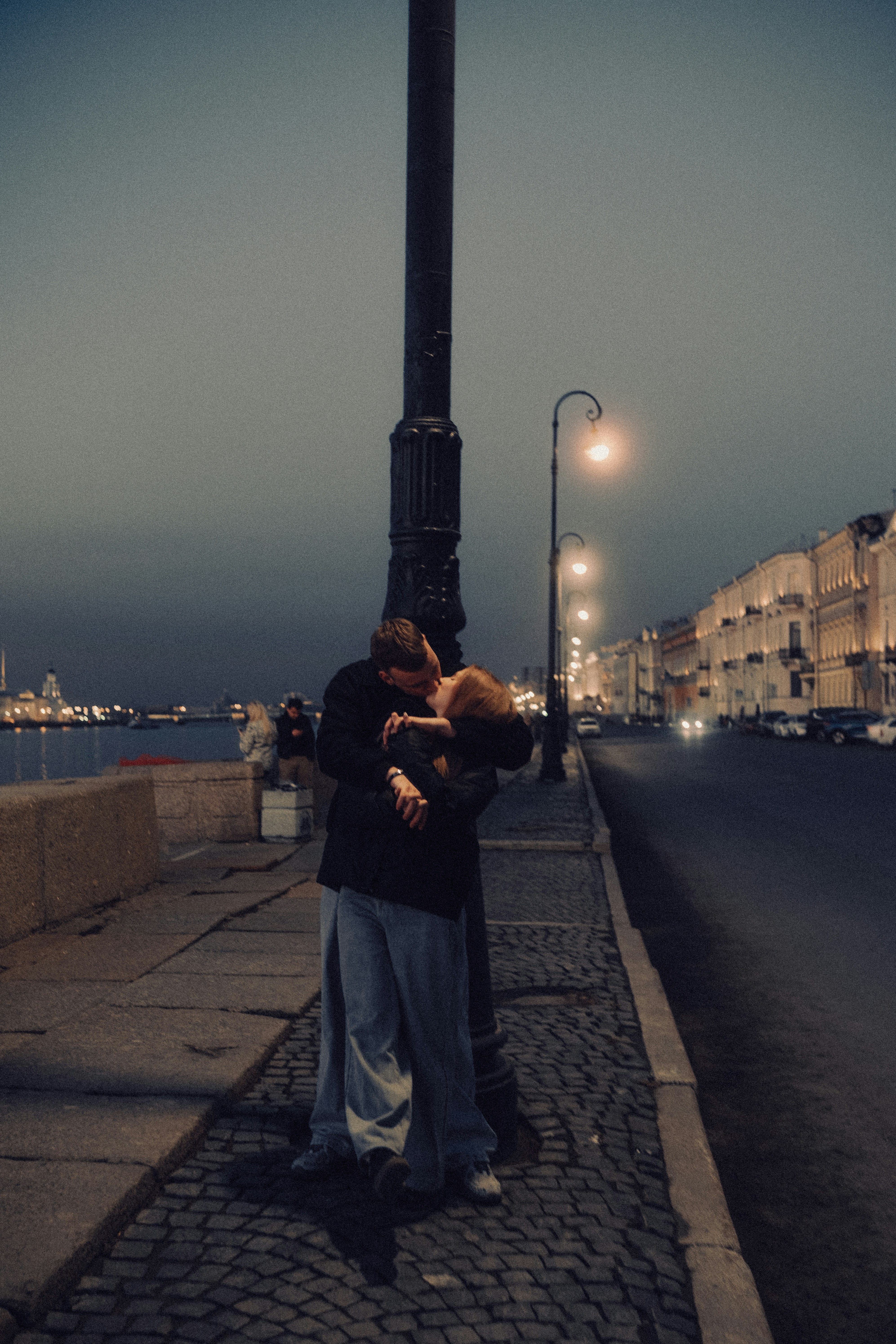 Midnight Embrace at the Seaside Promenade
