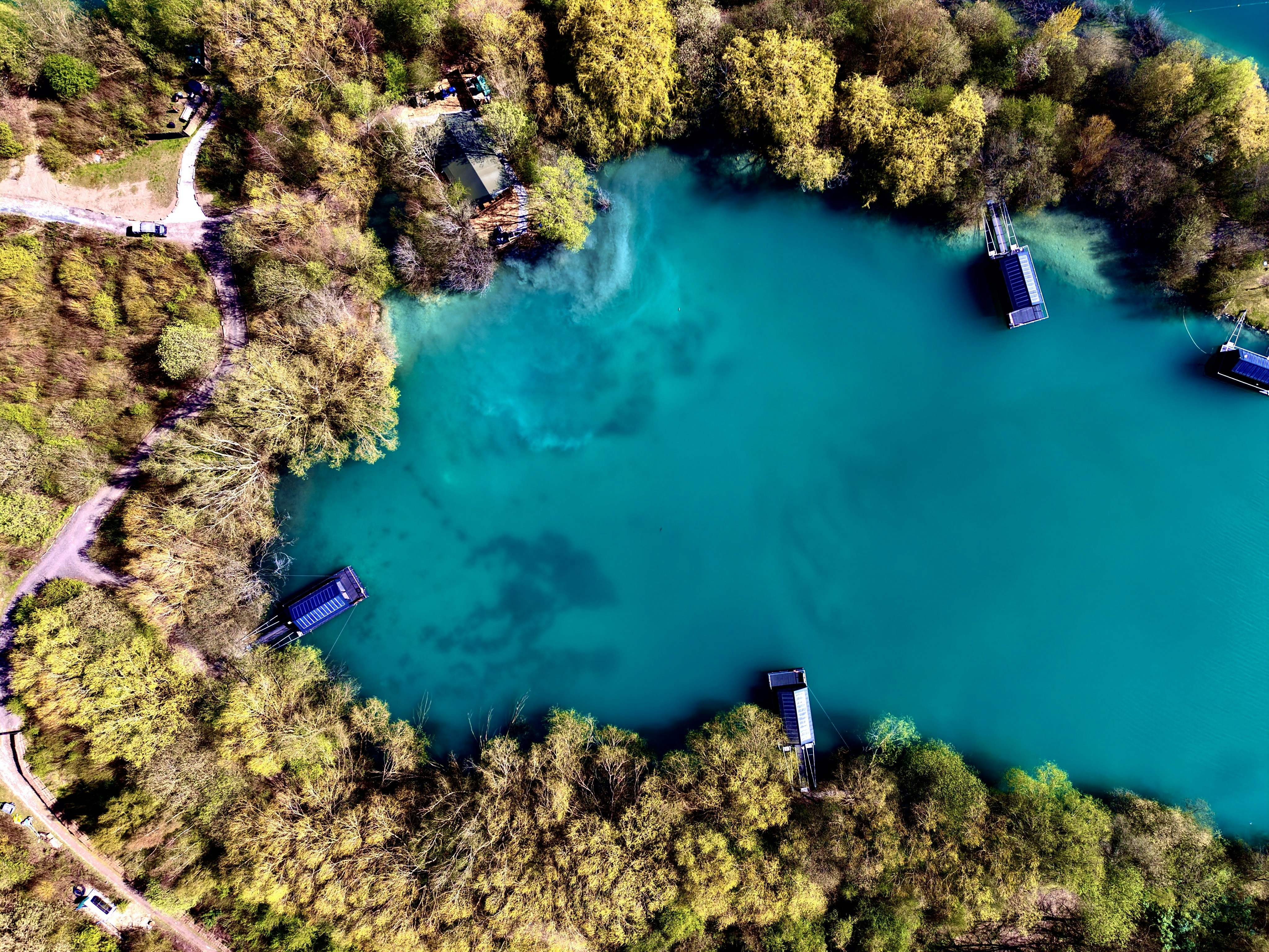 A Turquoise Oasis Surrounded by Autumn Canopy