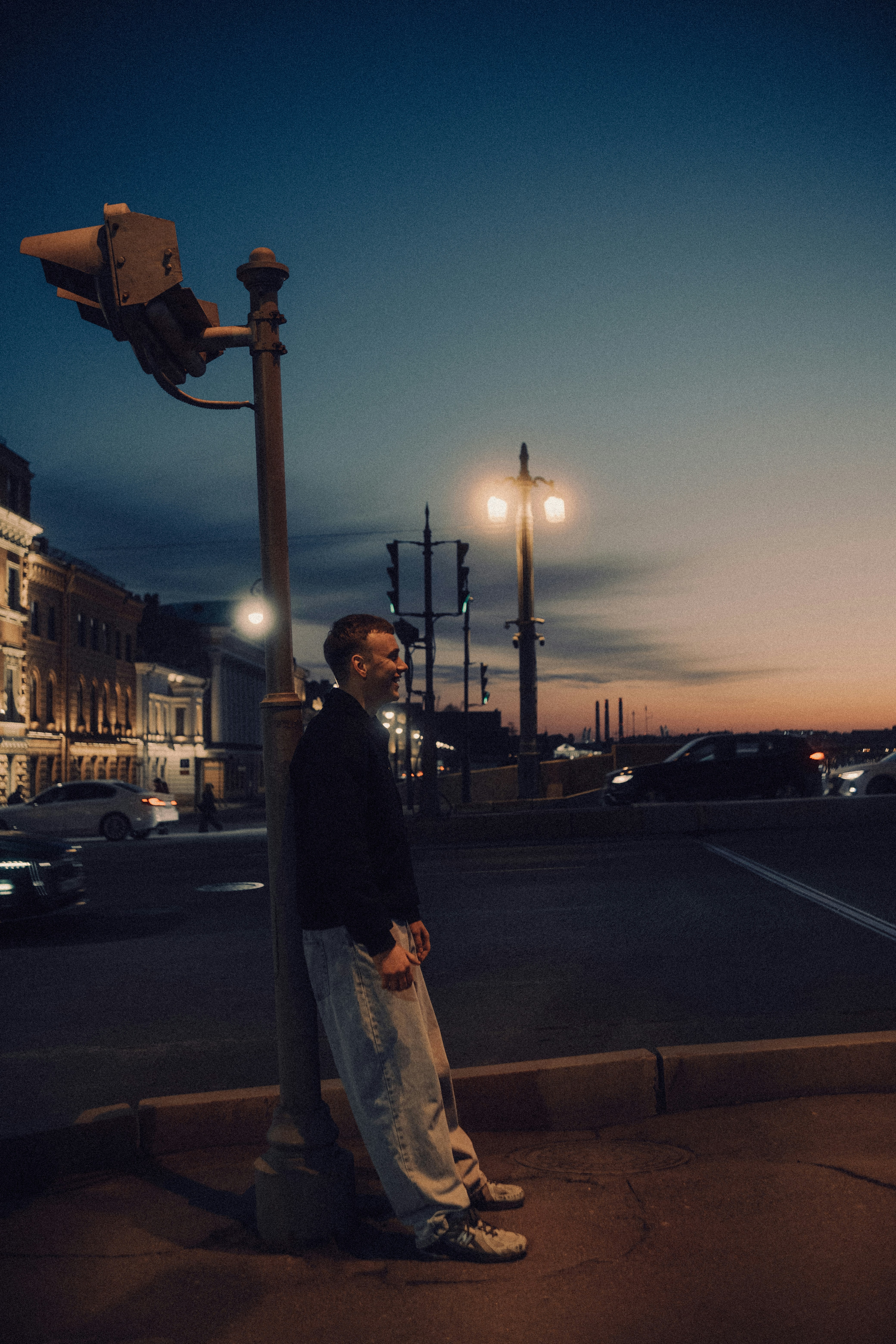Night Lane Portrait: Man in streetlight glow by the harbor