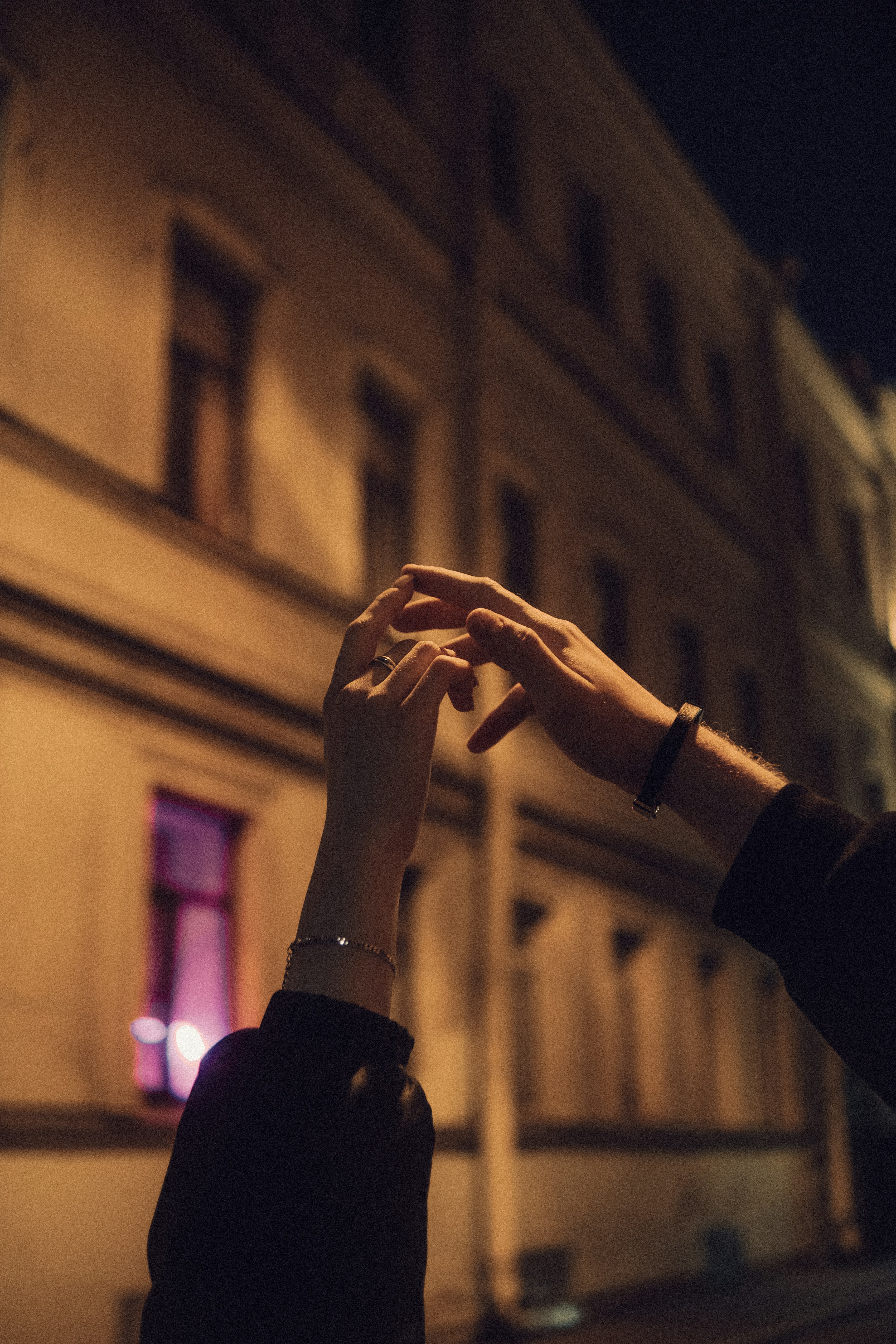 A Quiet Embrace: Night moment of interlaced fingers